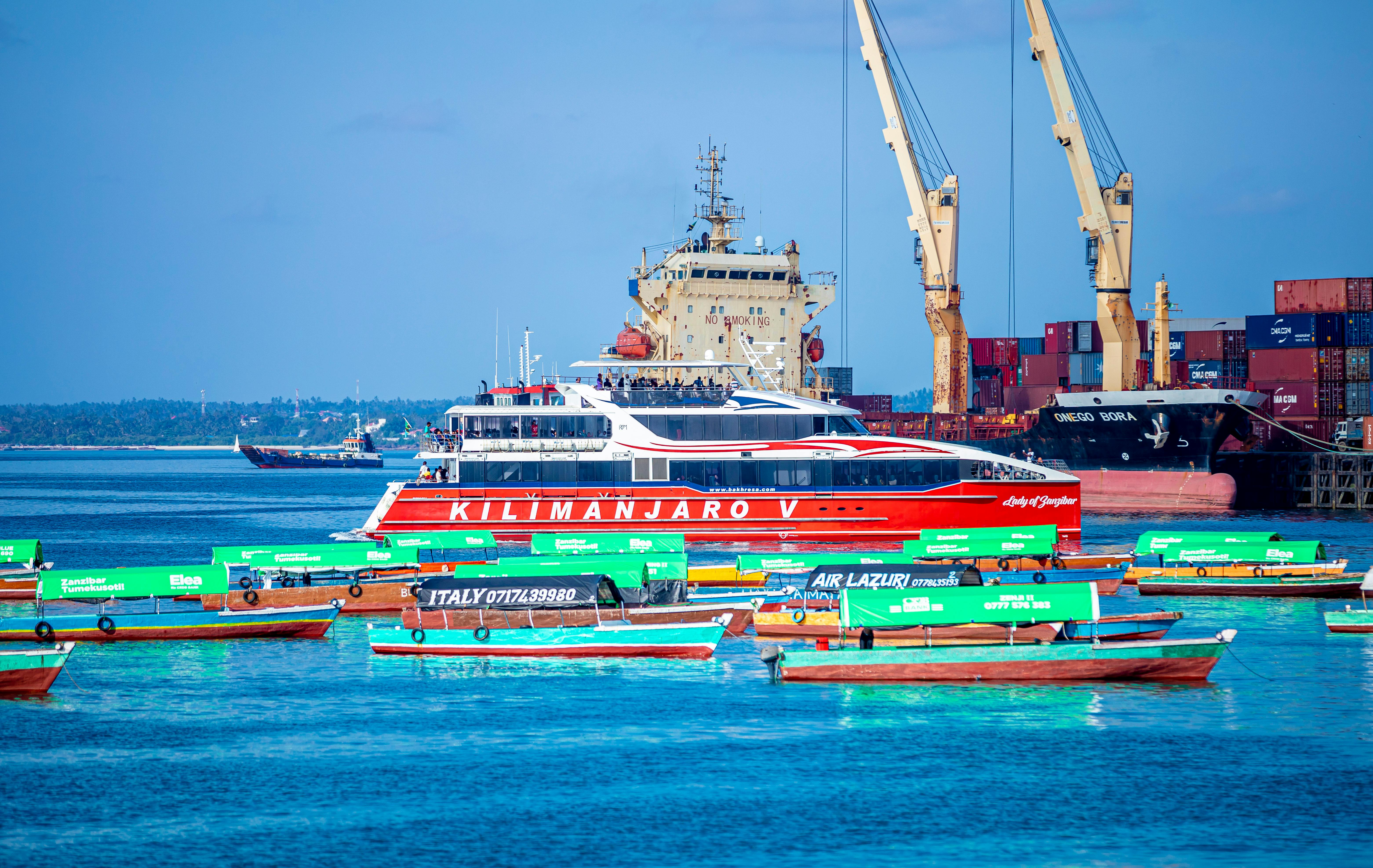 Colorful Boats and Ferry at Dar es Salaam Port · Free Stock Photo