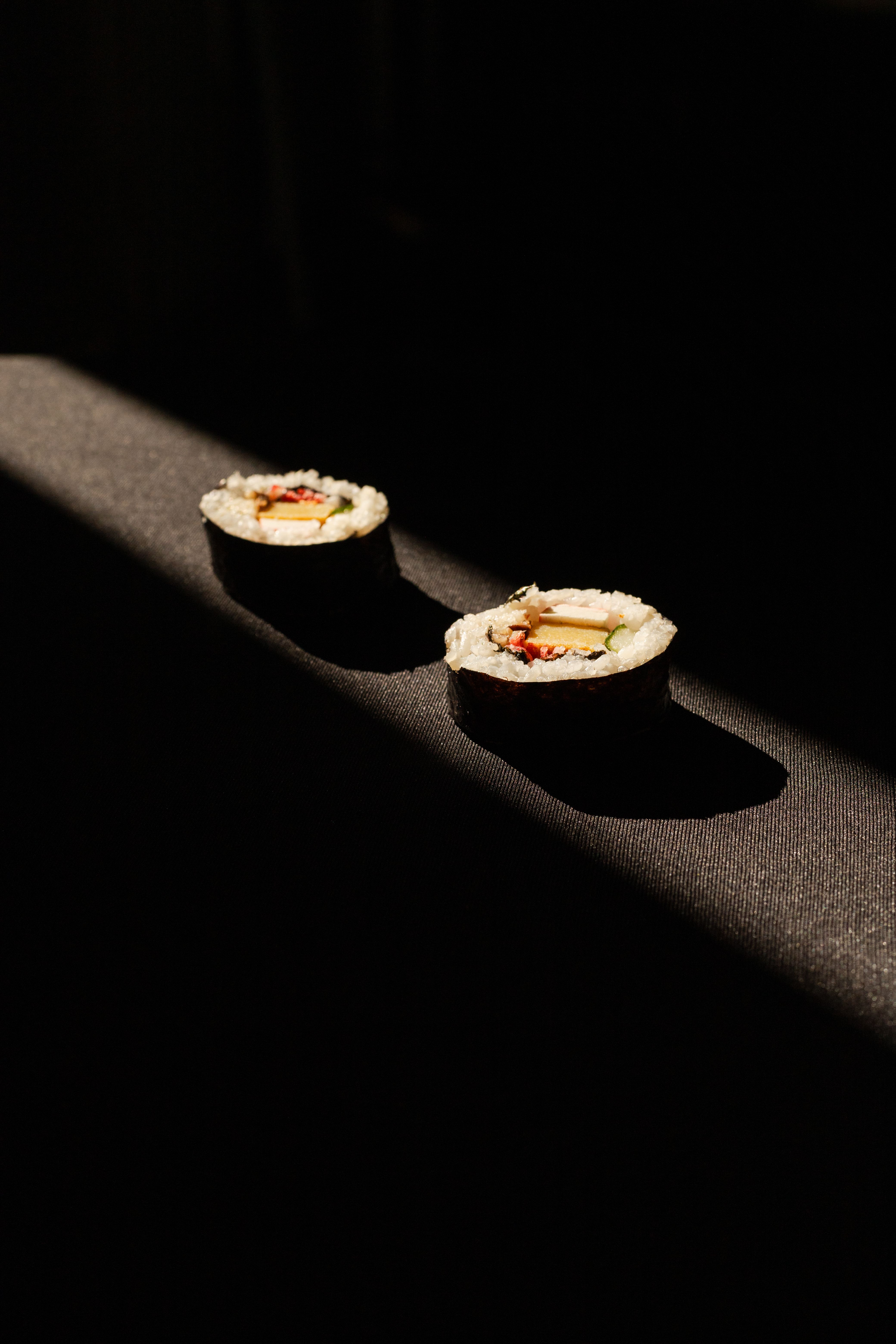 Minimalist Lighting on Japanese Sushi Rolls · Free Stock Photo