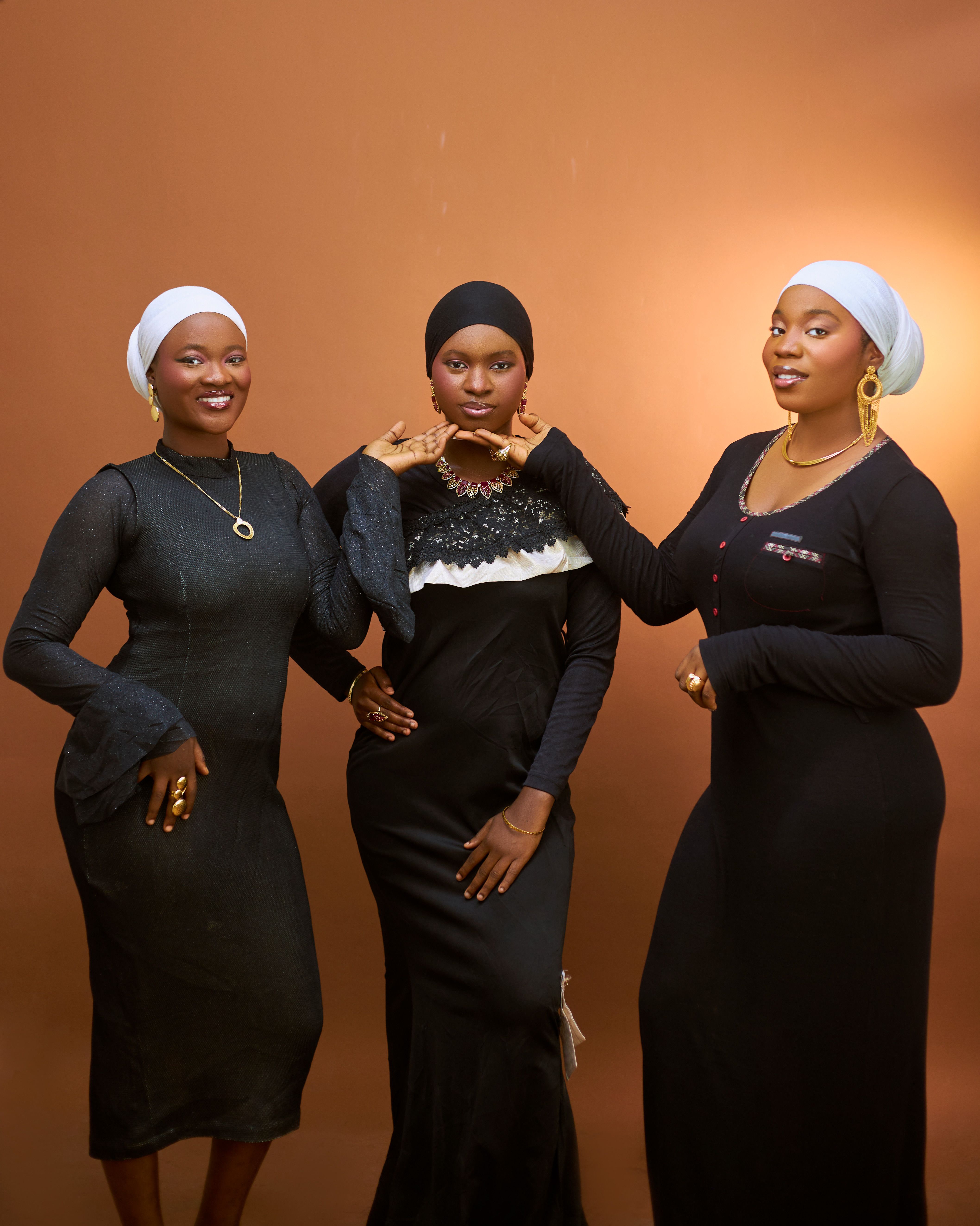 Elegant Portrait of Three Women in Stylish Black Dresses · Free Stock Photo