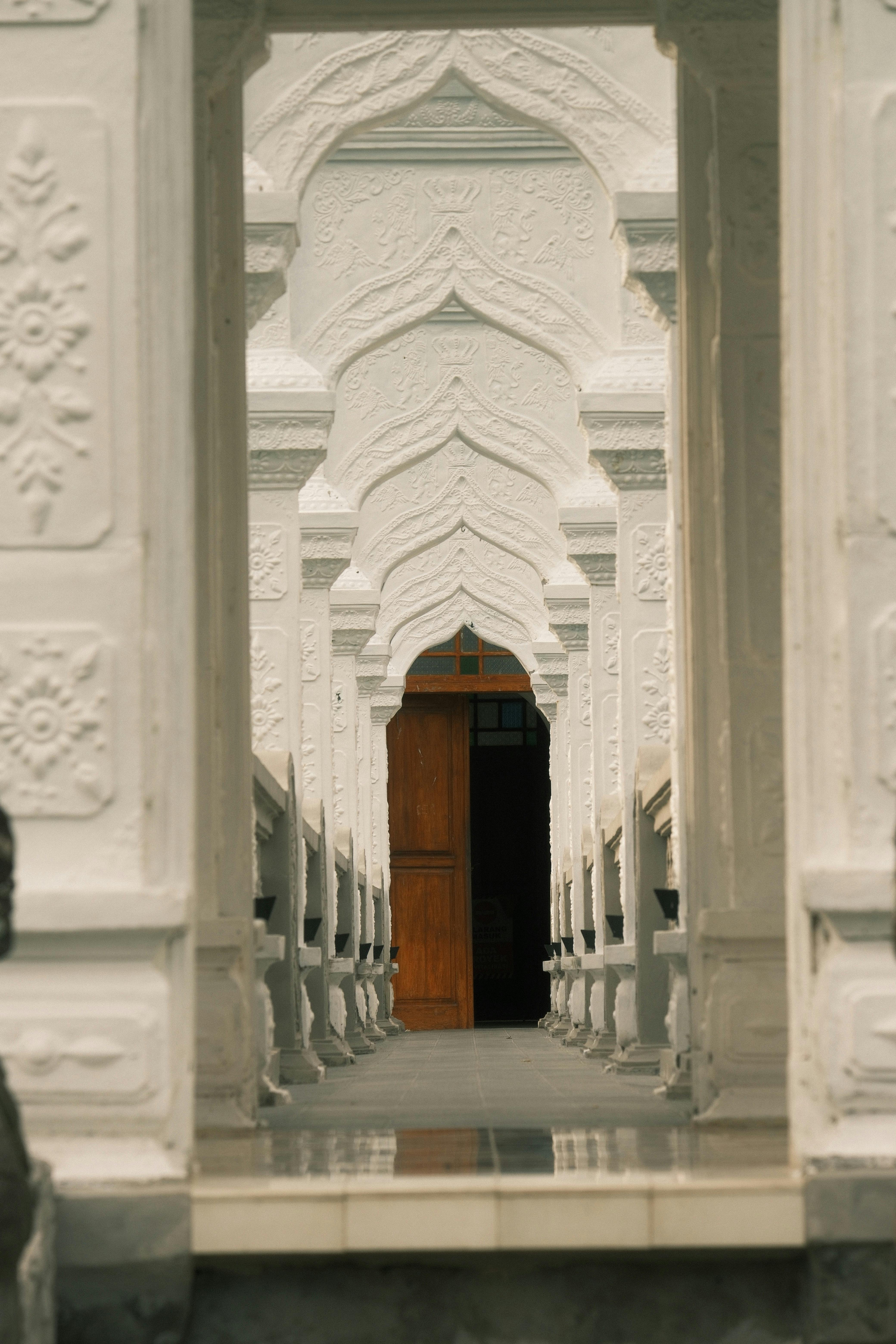 Intricate White Temple Archway with Open Door · Free Stock Photo