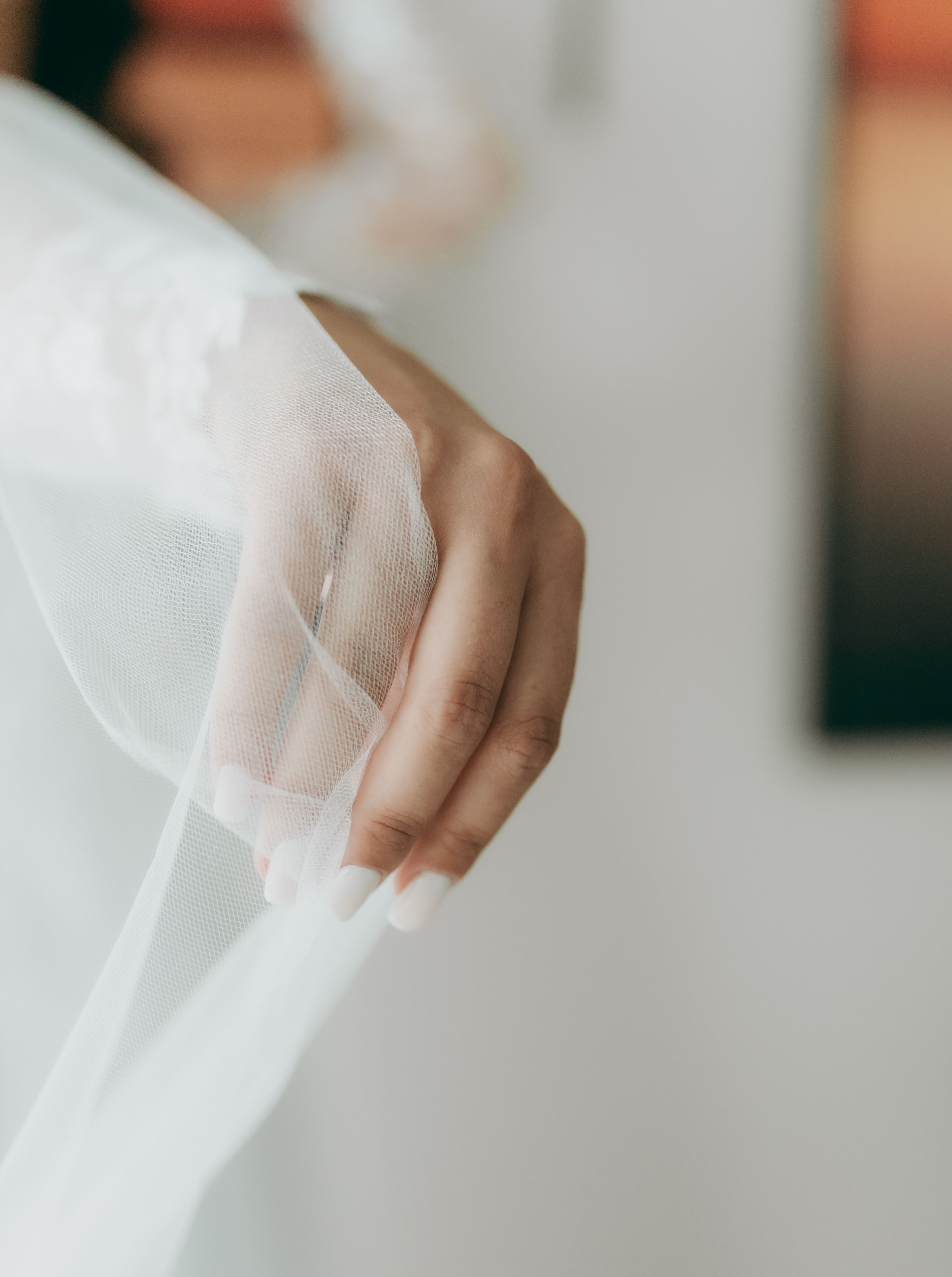 Close-Up of Elegant Bridal Hand in Wedding Dress · Free Stock Photo
