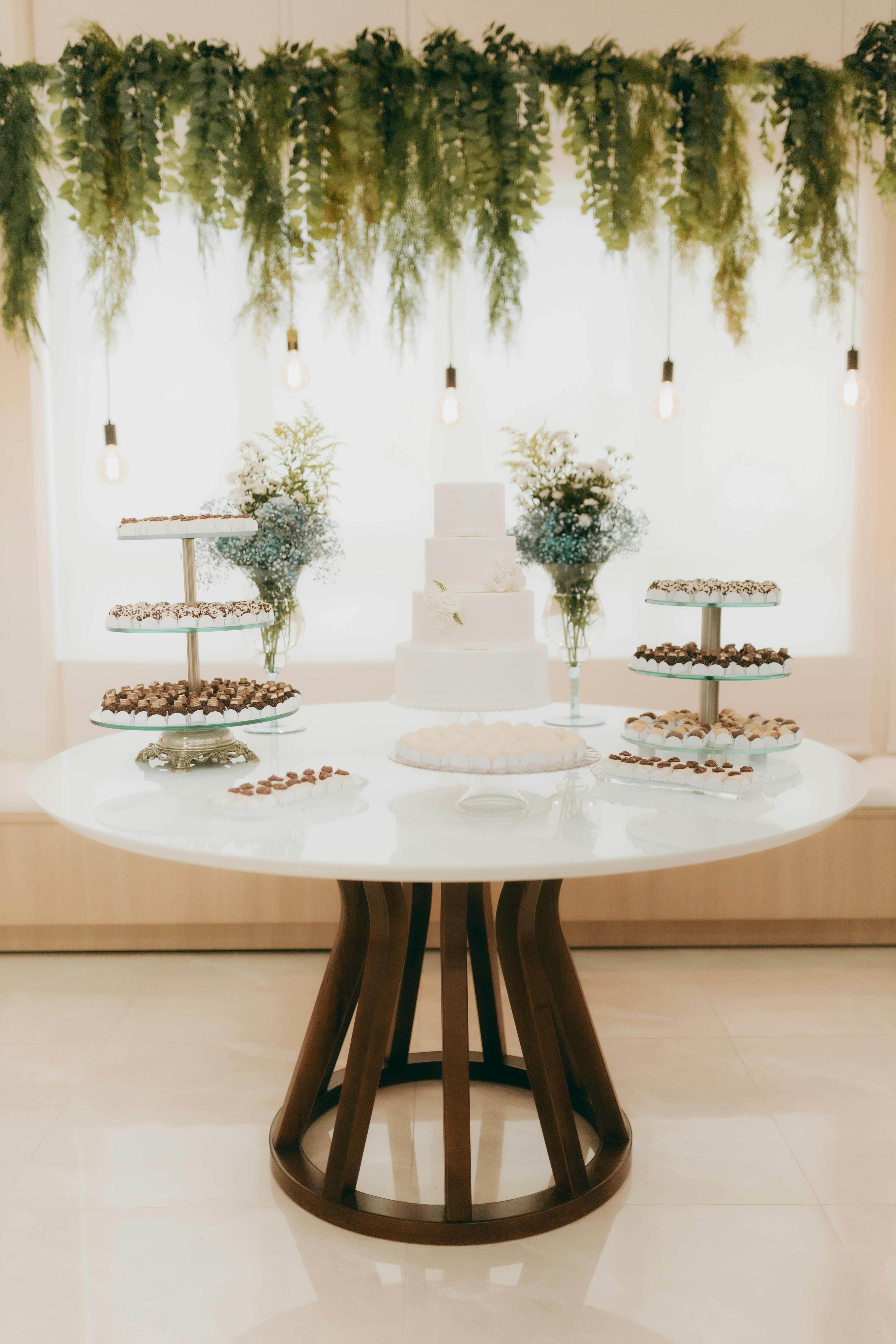 Elegant Wedding Dessert Table with Greenery Décor · Free Stock Photo