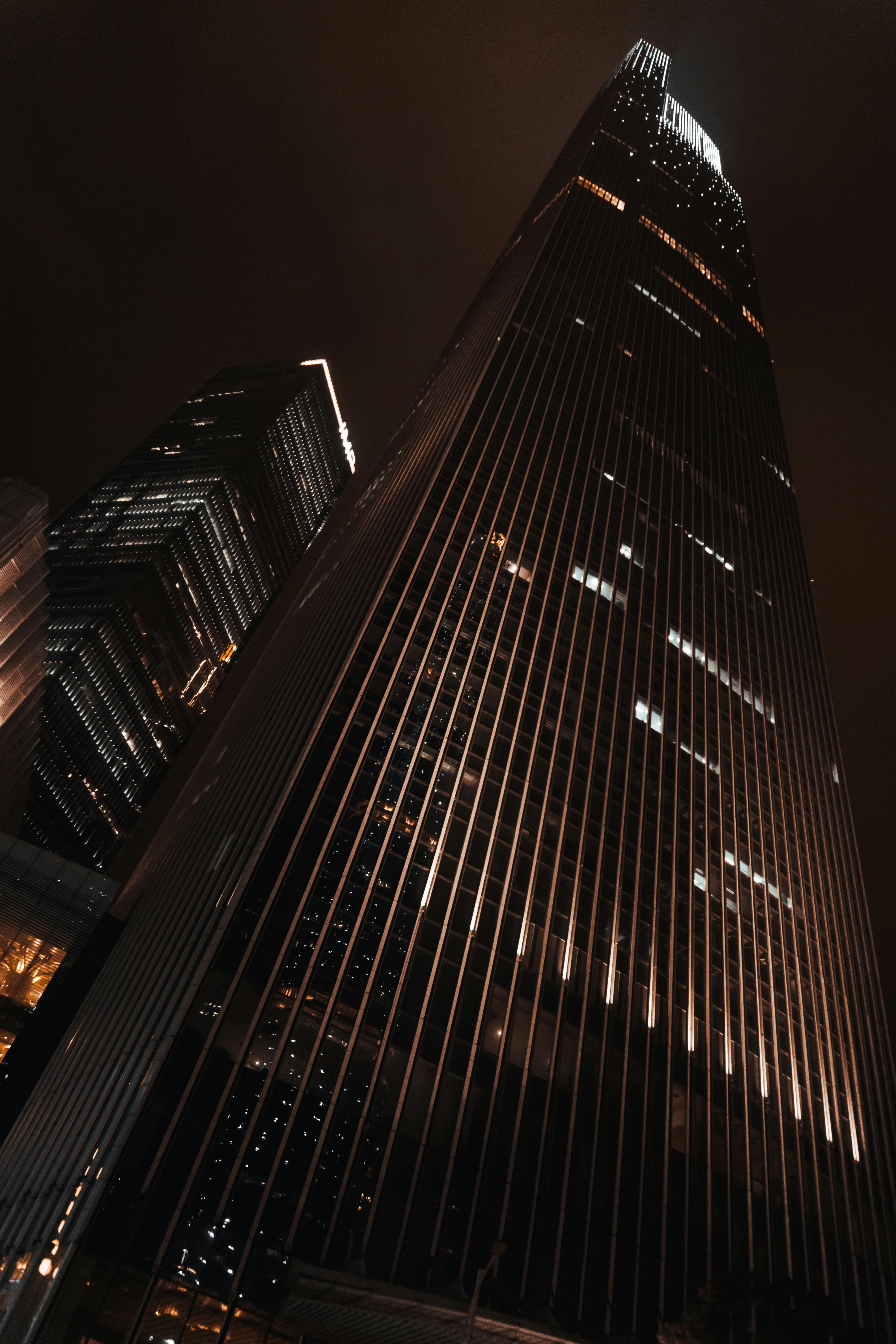 Low Angle Photo Of High-Rise Building During Nighttime · Free Stock Photo