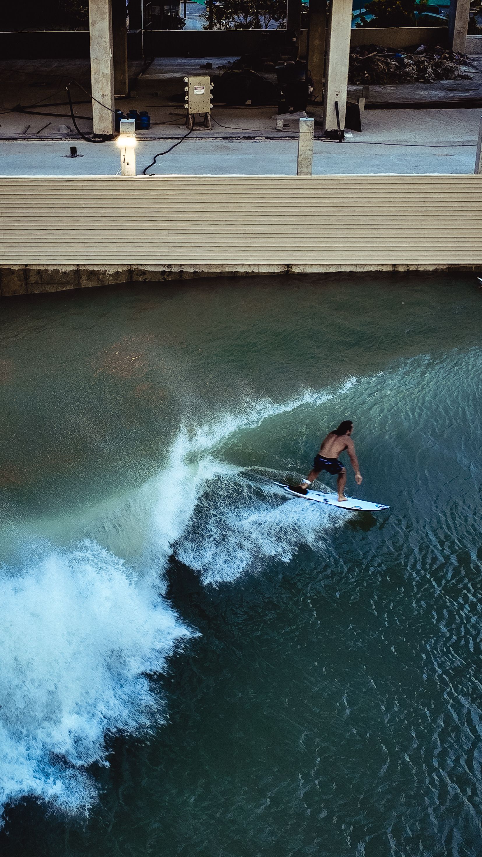 Aerial View of Surfer Riding Artificial Wave at Indoor Pool · Free ...