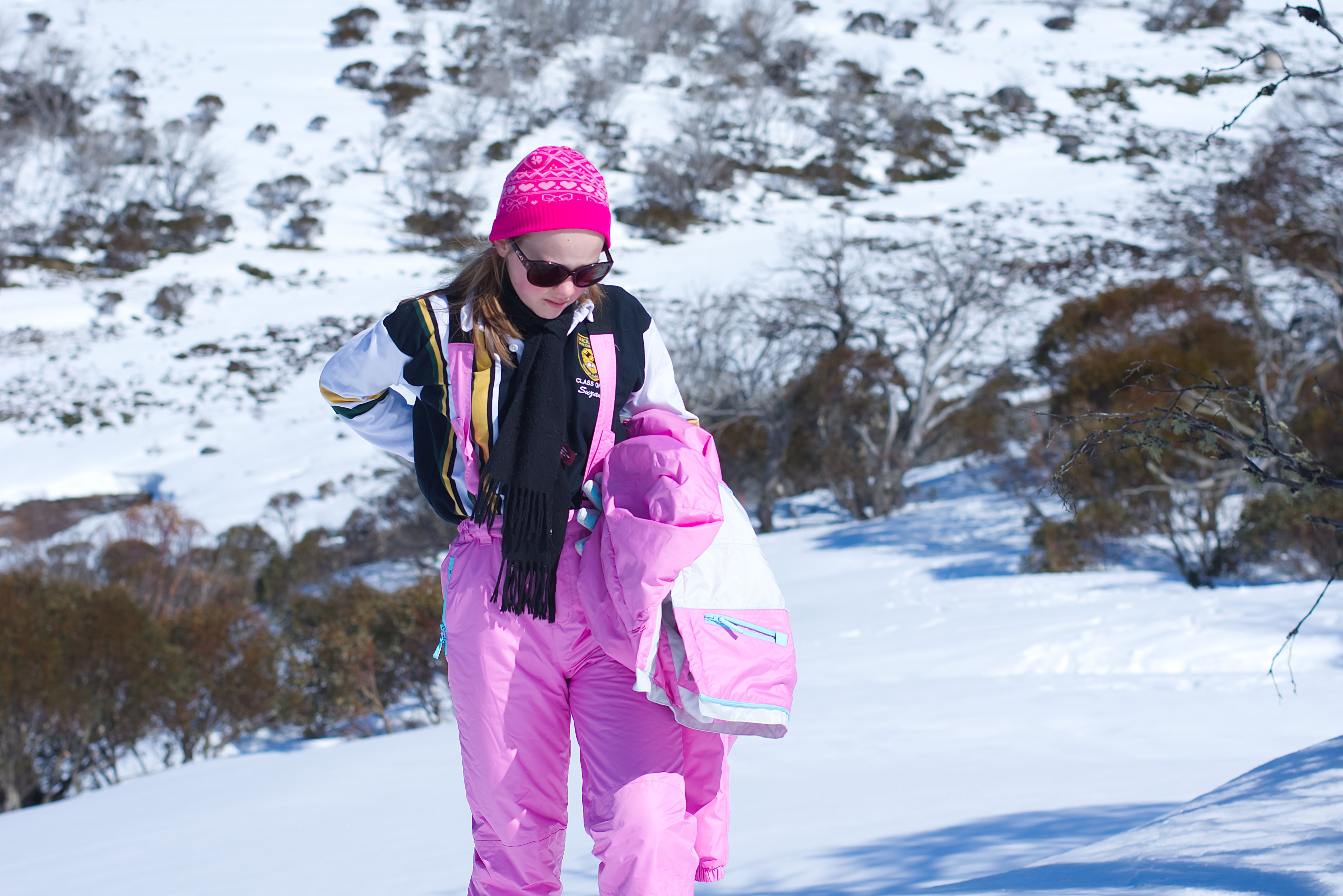Woman in Pink Snow Gear Enjoying Winter Outdoors · Free Stock Photo