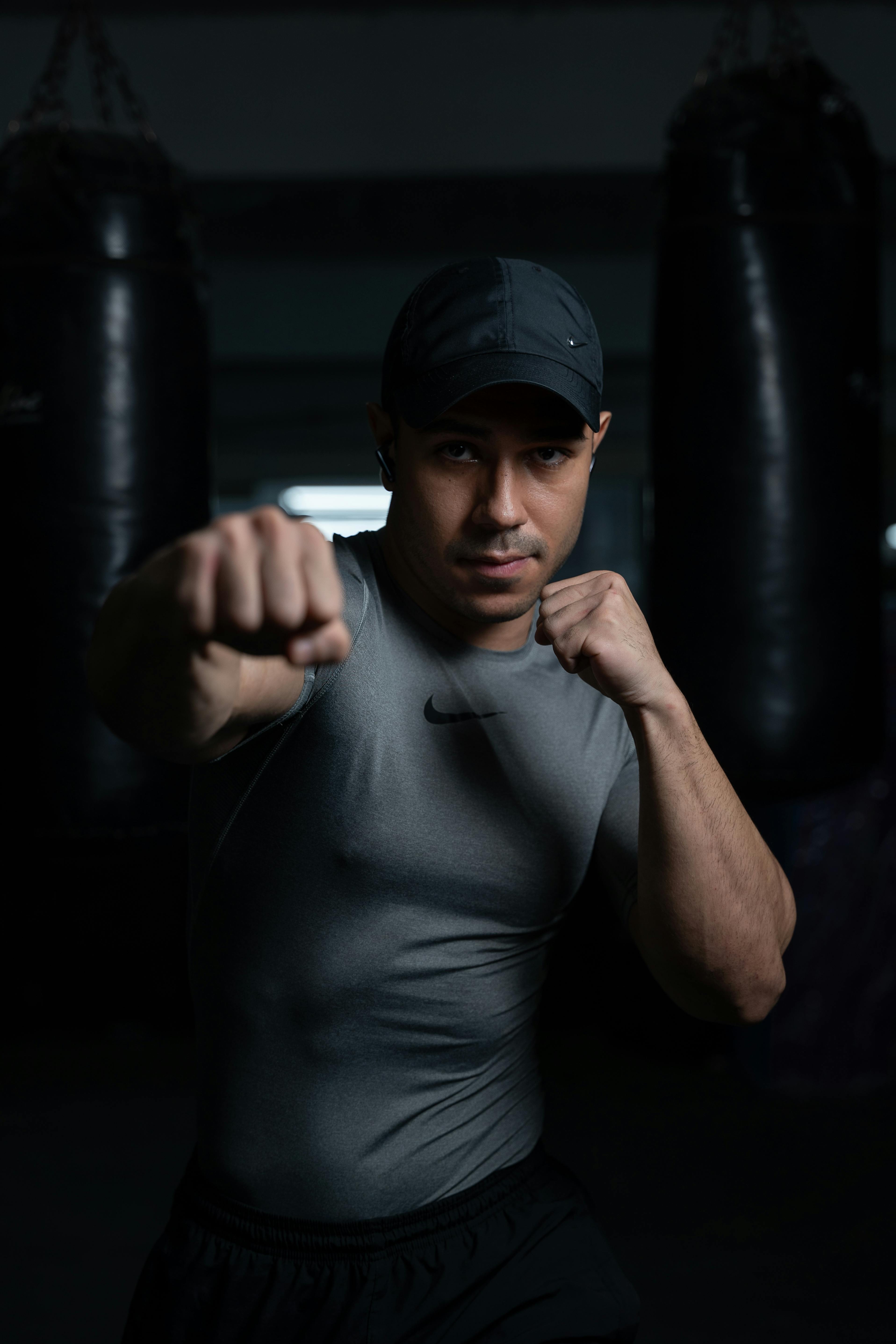 Focused Boxer Training Indoors in Gym · Free Stock Photo