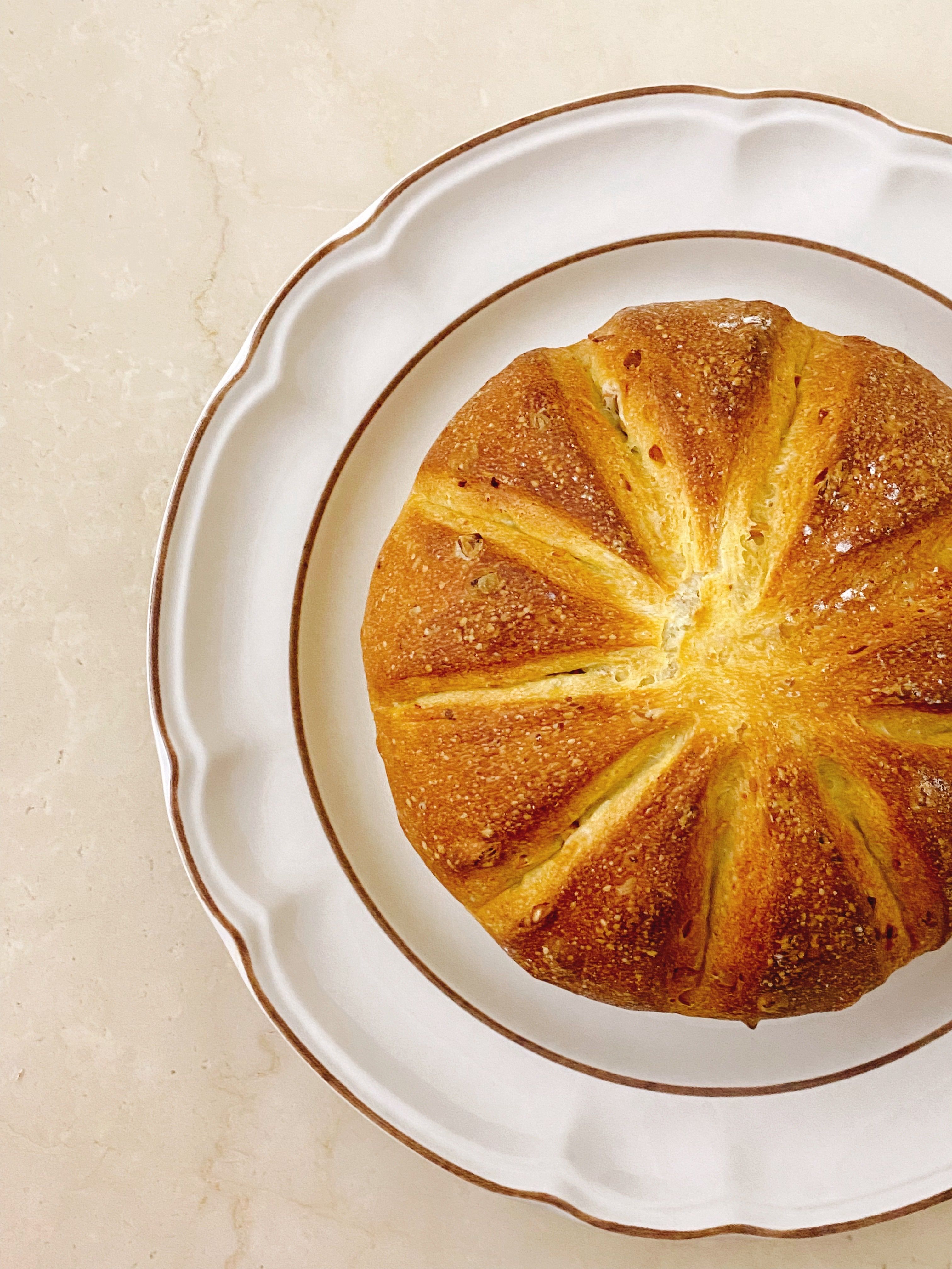 Artisan Round Bread on Elegant Plate · Free Stock Photo