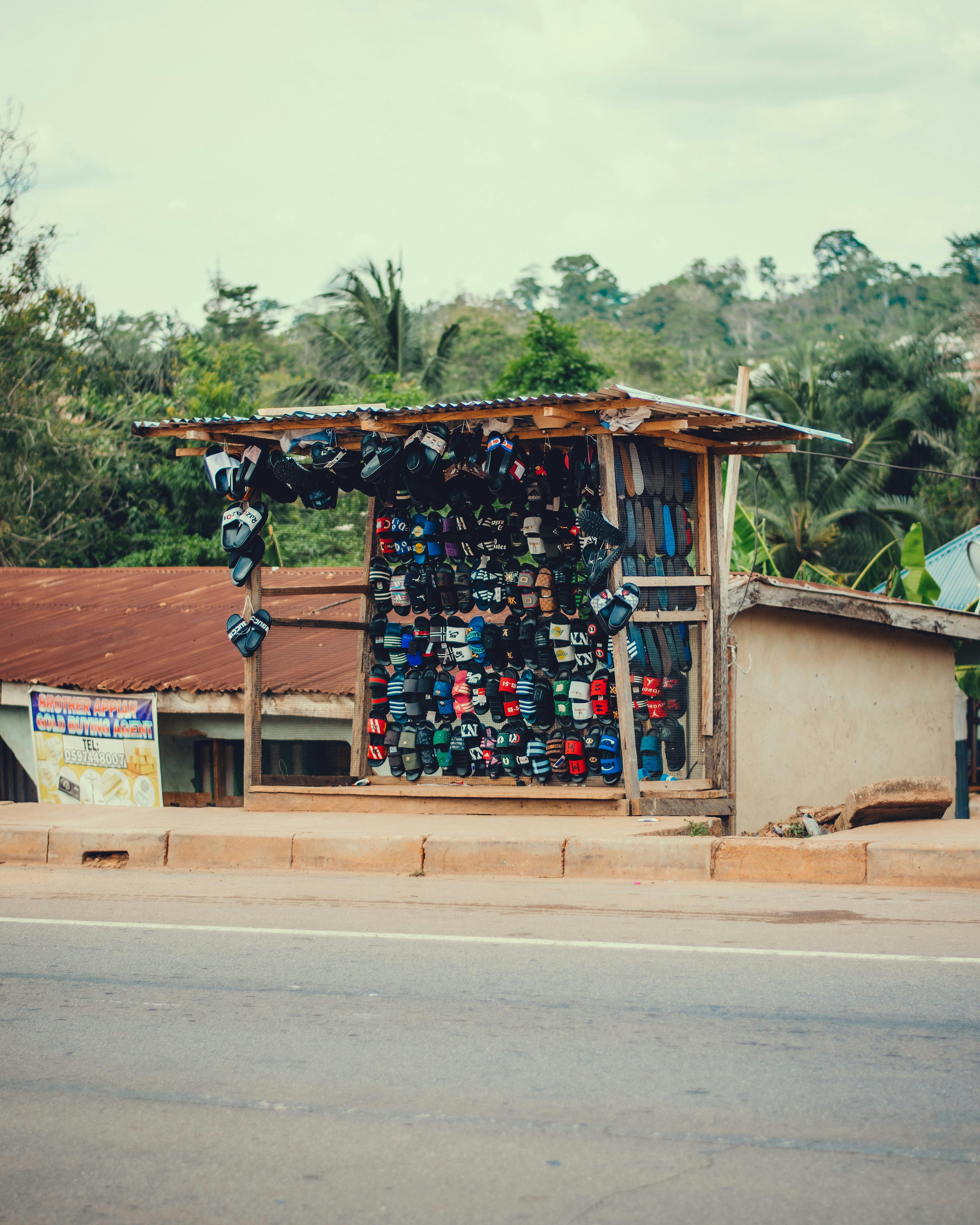 Rustic Roadside Shoe Stall Display Outdoors · Free Stock Photo