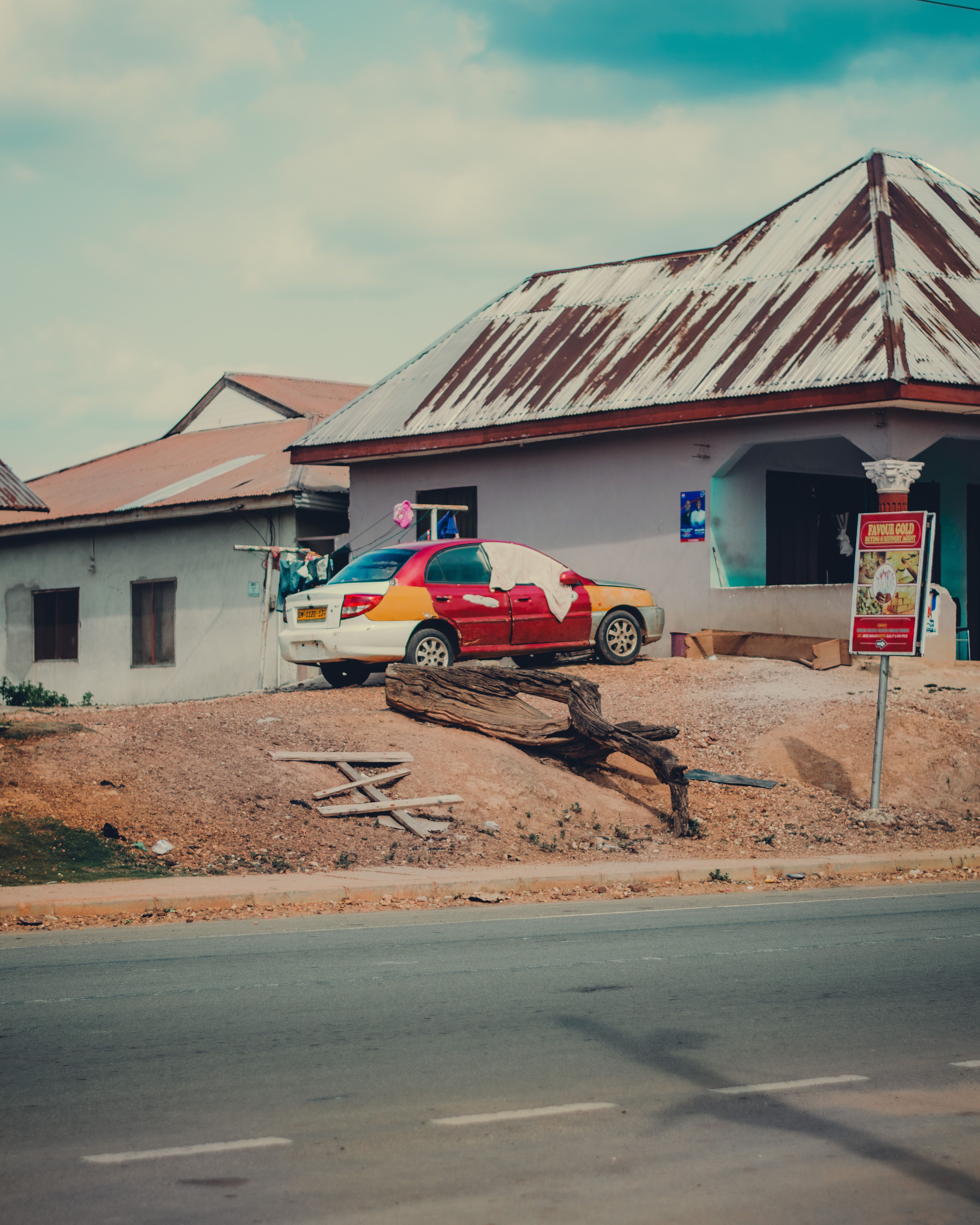 Colorful Car Parked by Rural Roadside Shop · Free Stock Photo