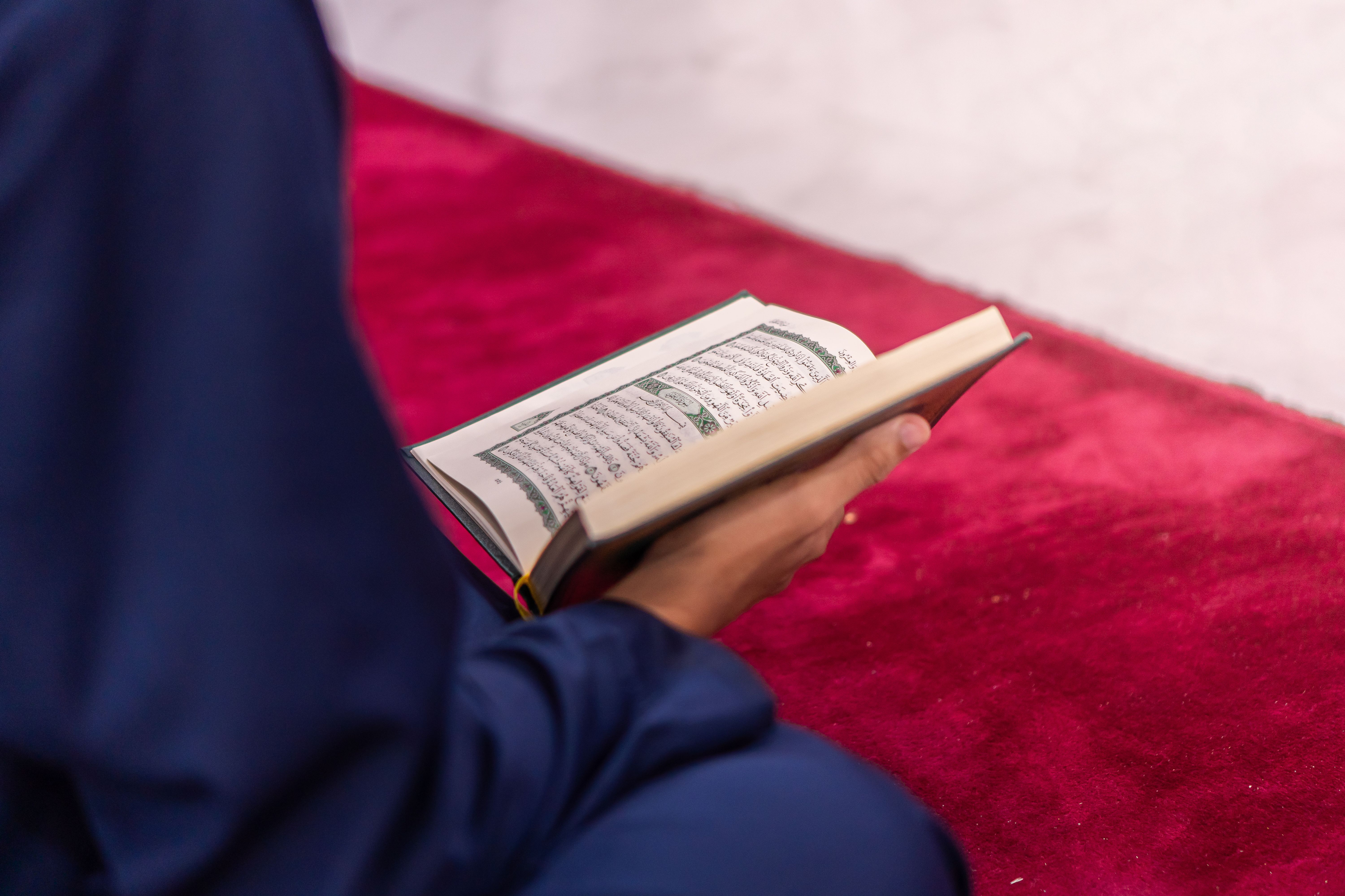 Muslim Reading Quran Indoors at Night · Free Stock Photo