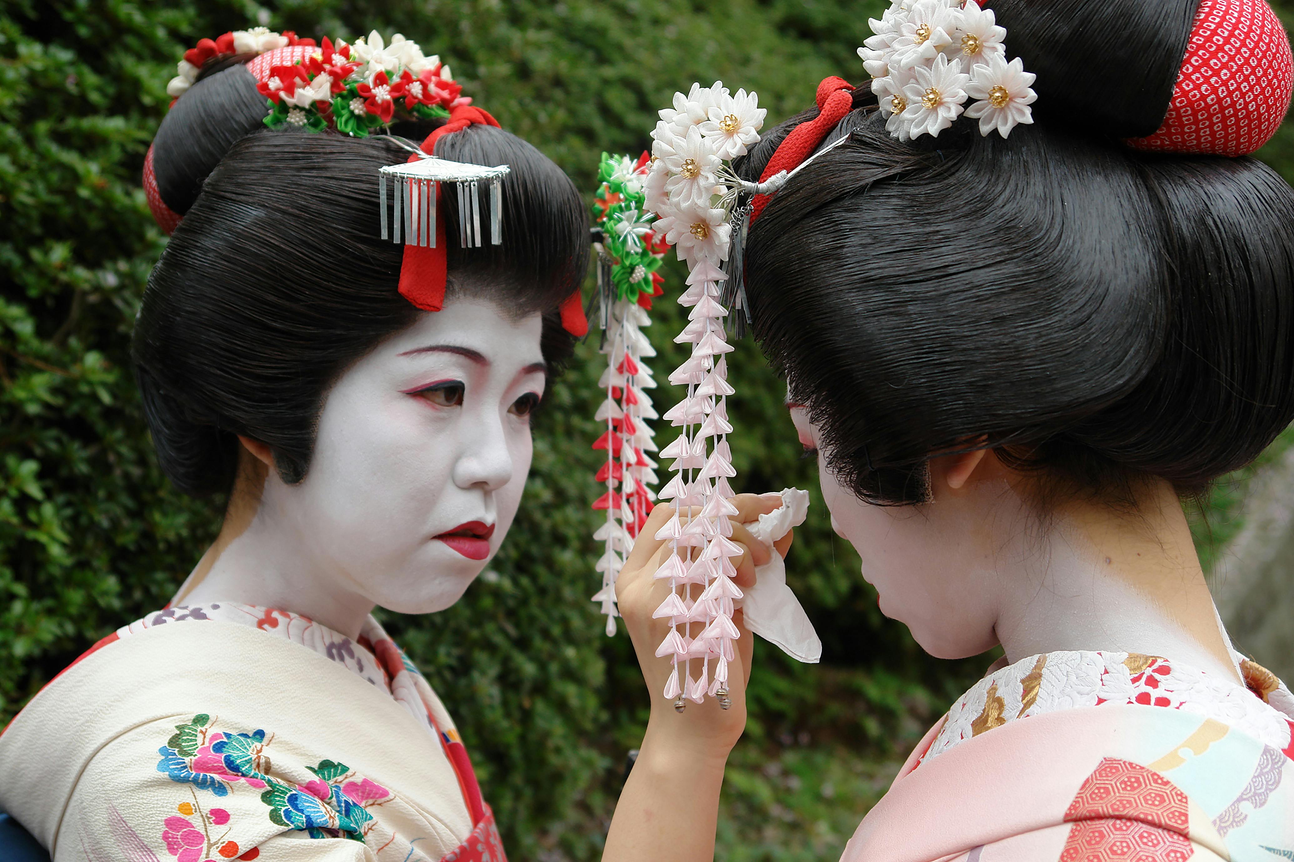 Traditional Geisha in Kyoto with Elaborate Hairstyles · Free Stock Photo
