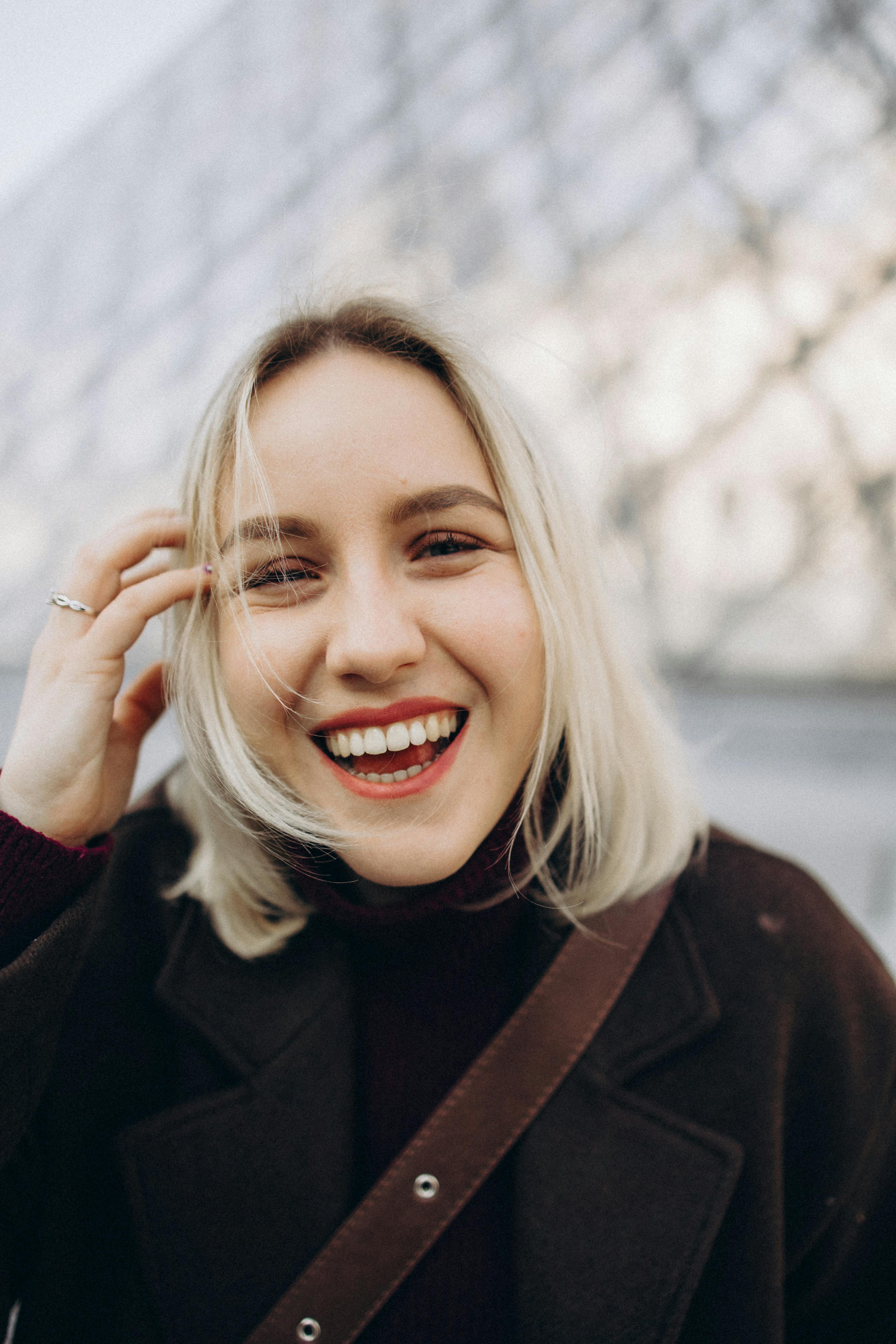 Smiling Woman in Front of Louvre Pyramid, Paris · Free Stock Photo