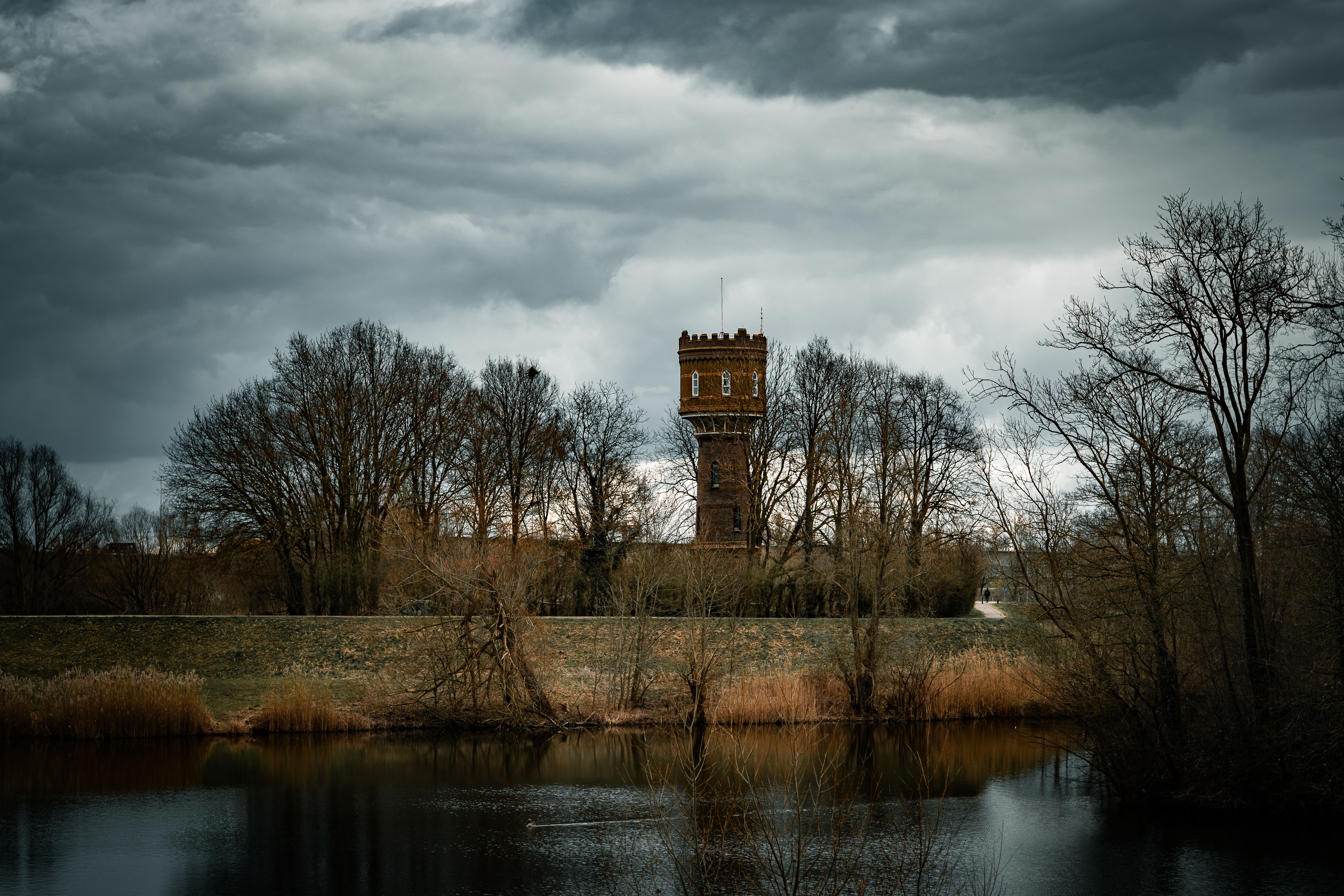 Dramatic Landscape with Tower and Trees · Free Stock Photo