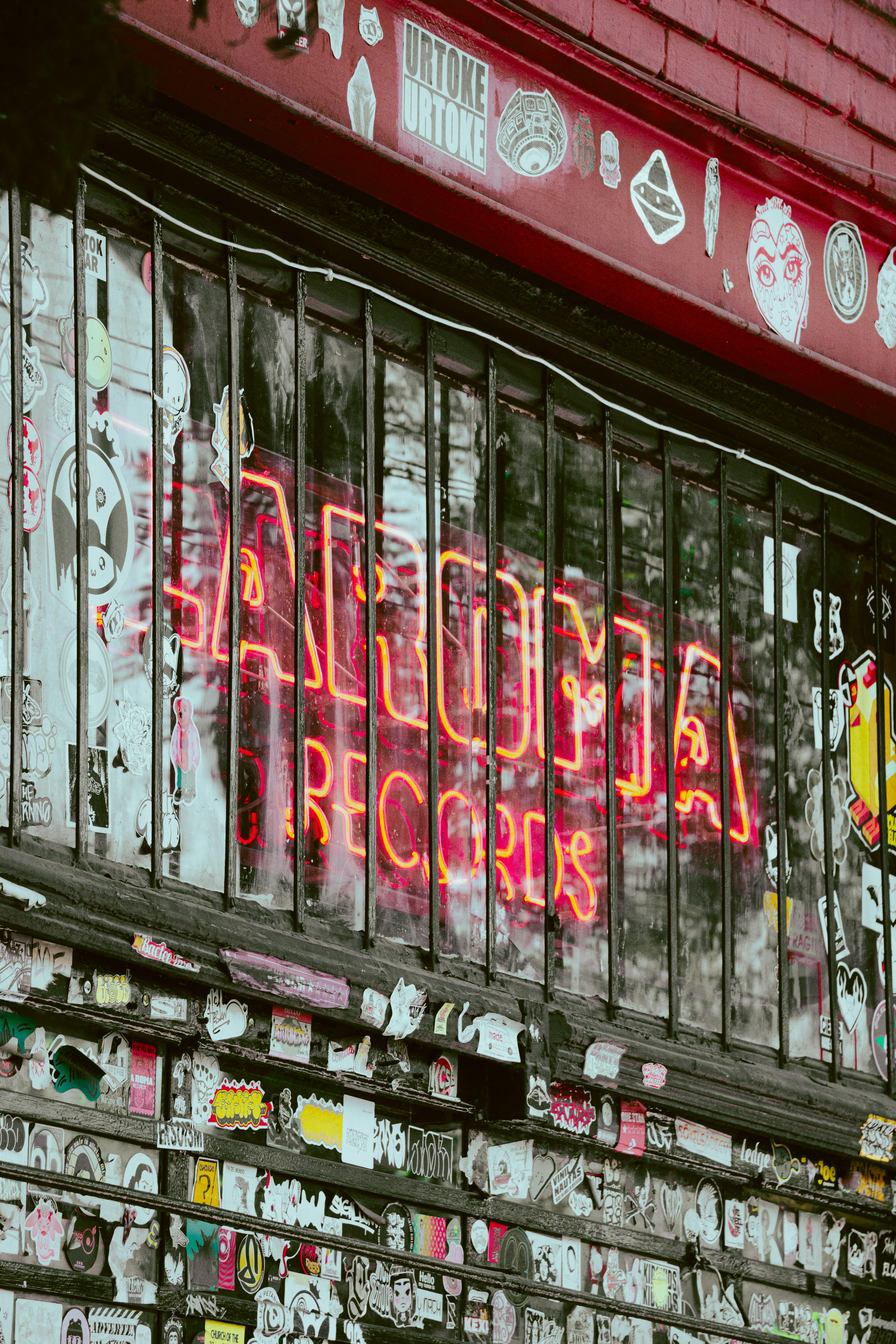 Vintage Neon Signage at a Record Shop Front · Free Stock Photo