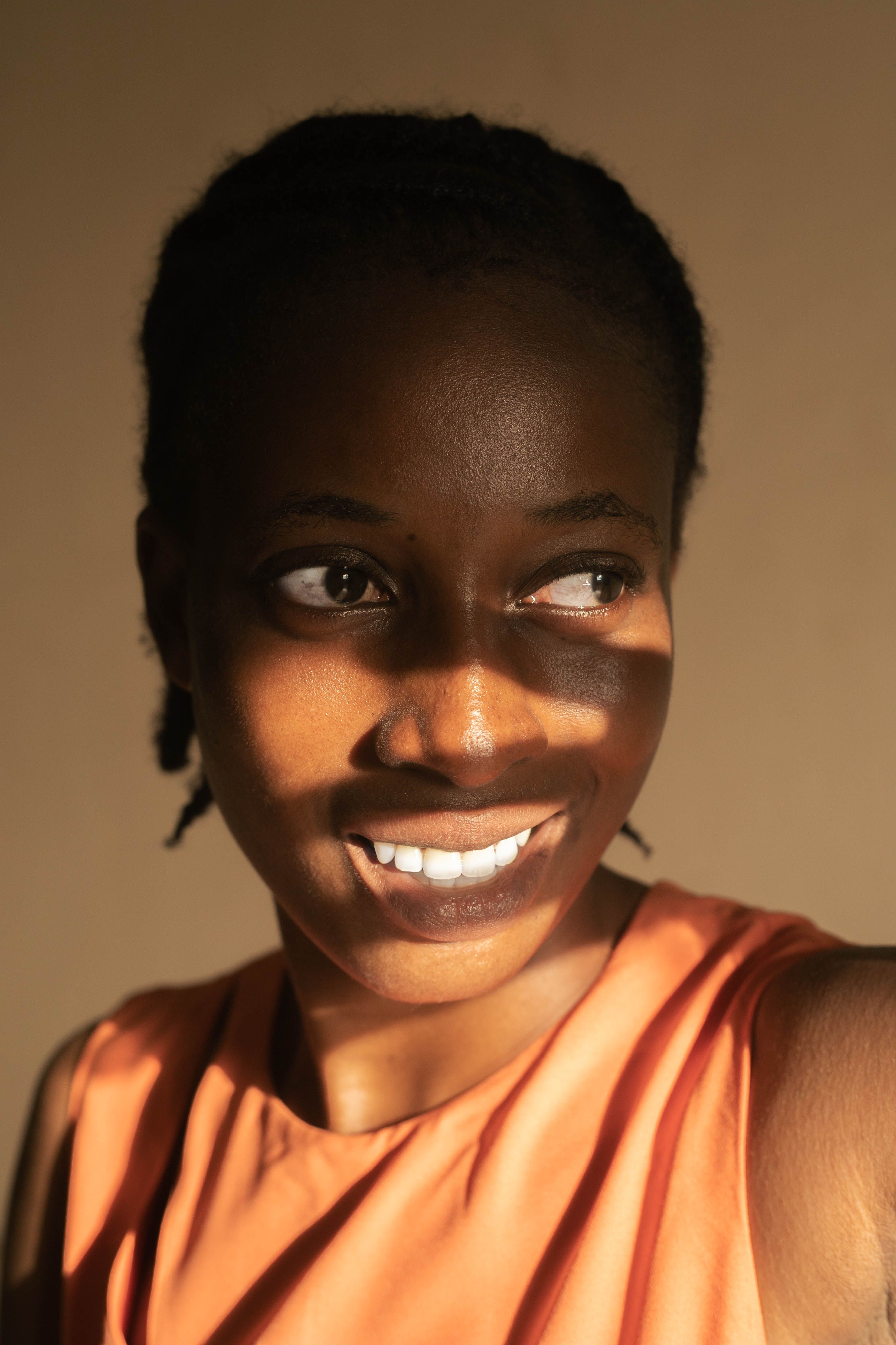 Warm Portrait of Smiling Woman in Sunlight · Free Stock Photo