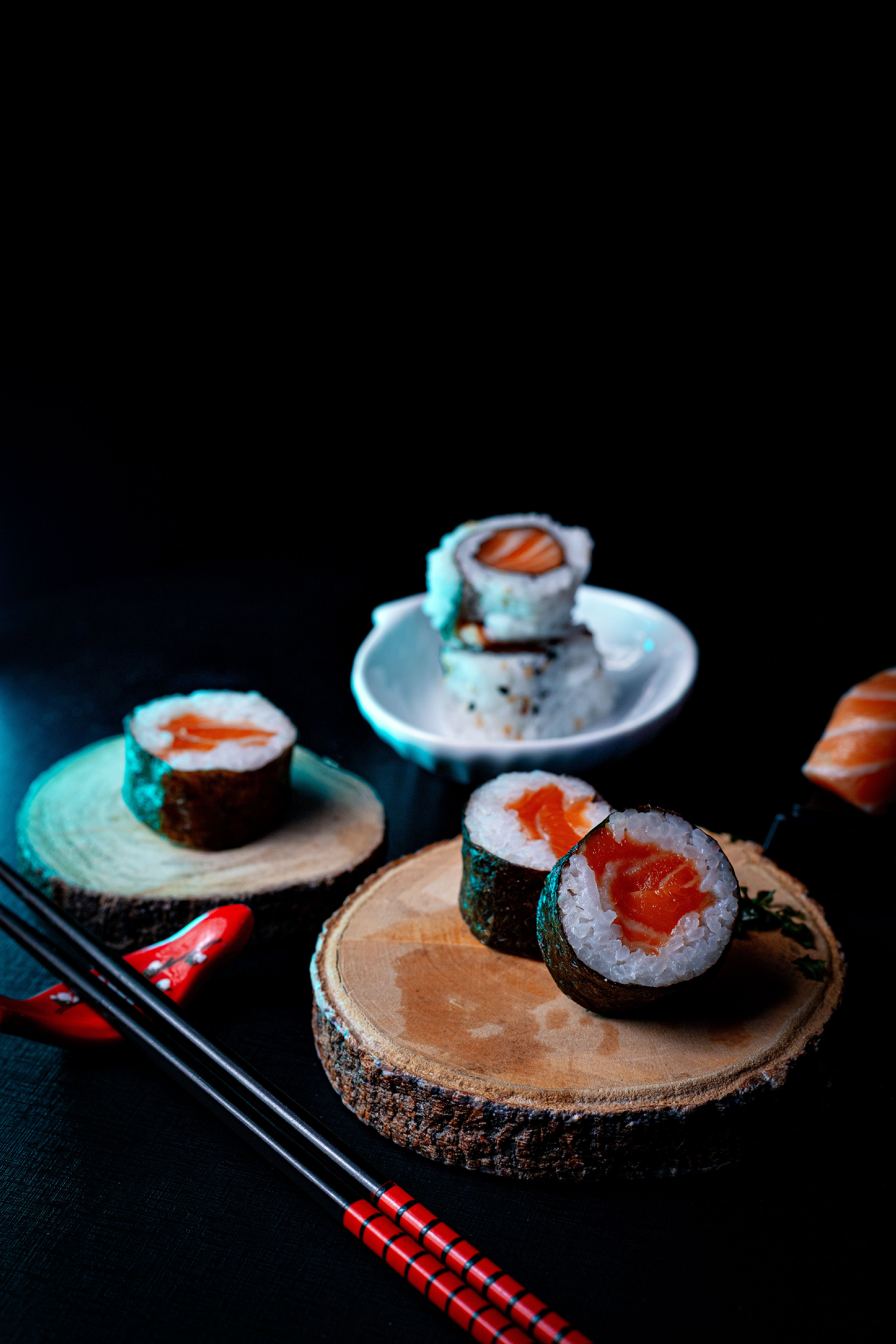 Artistic Sushi Presentation on Wooden Platters · Free Stock Photo