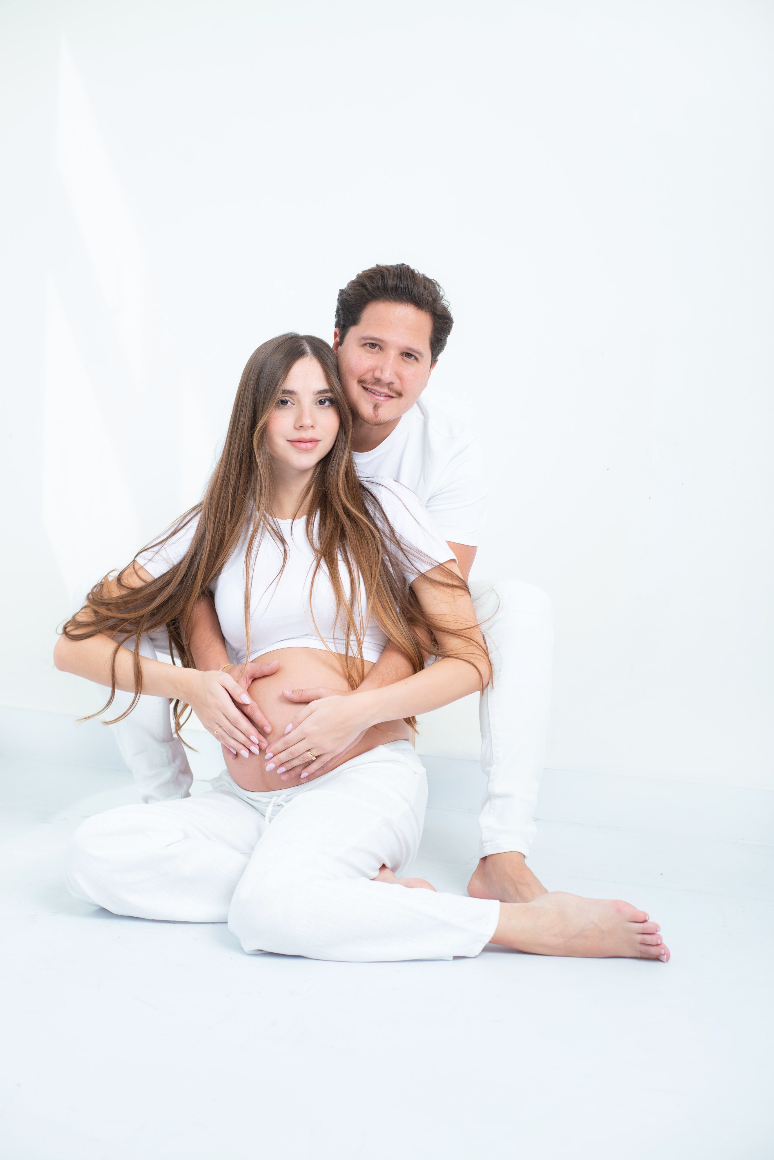 Expecting Couple in White Embrace and Celebrate Pregnancy · Free Stock ...