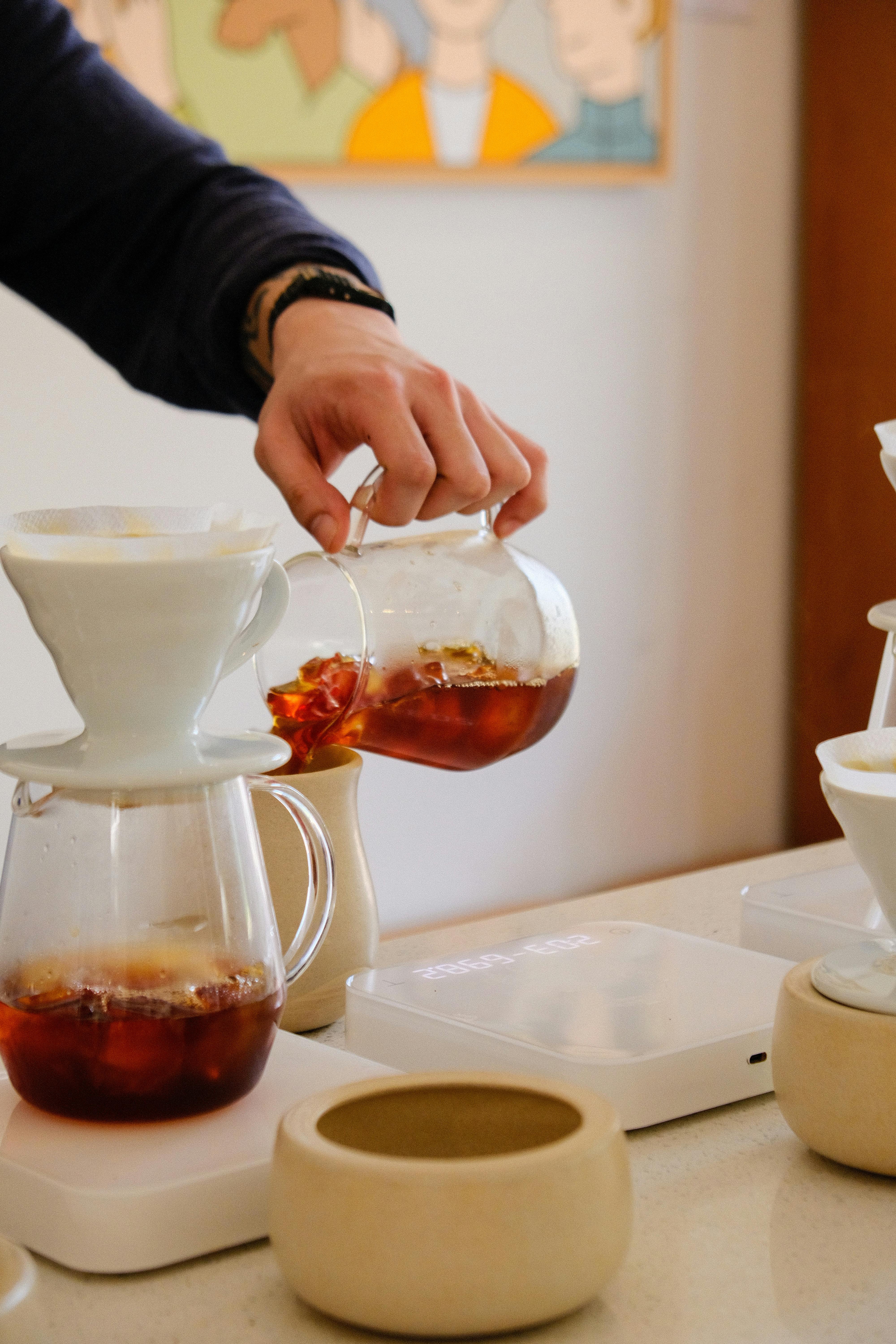Hand Brewing Coffee in a Modern Café Setting · Free Stock Photo