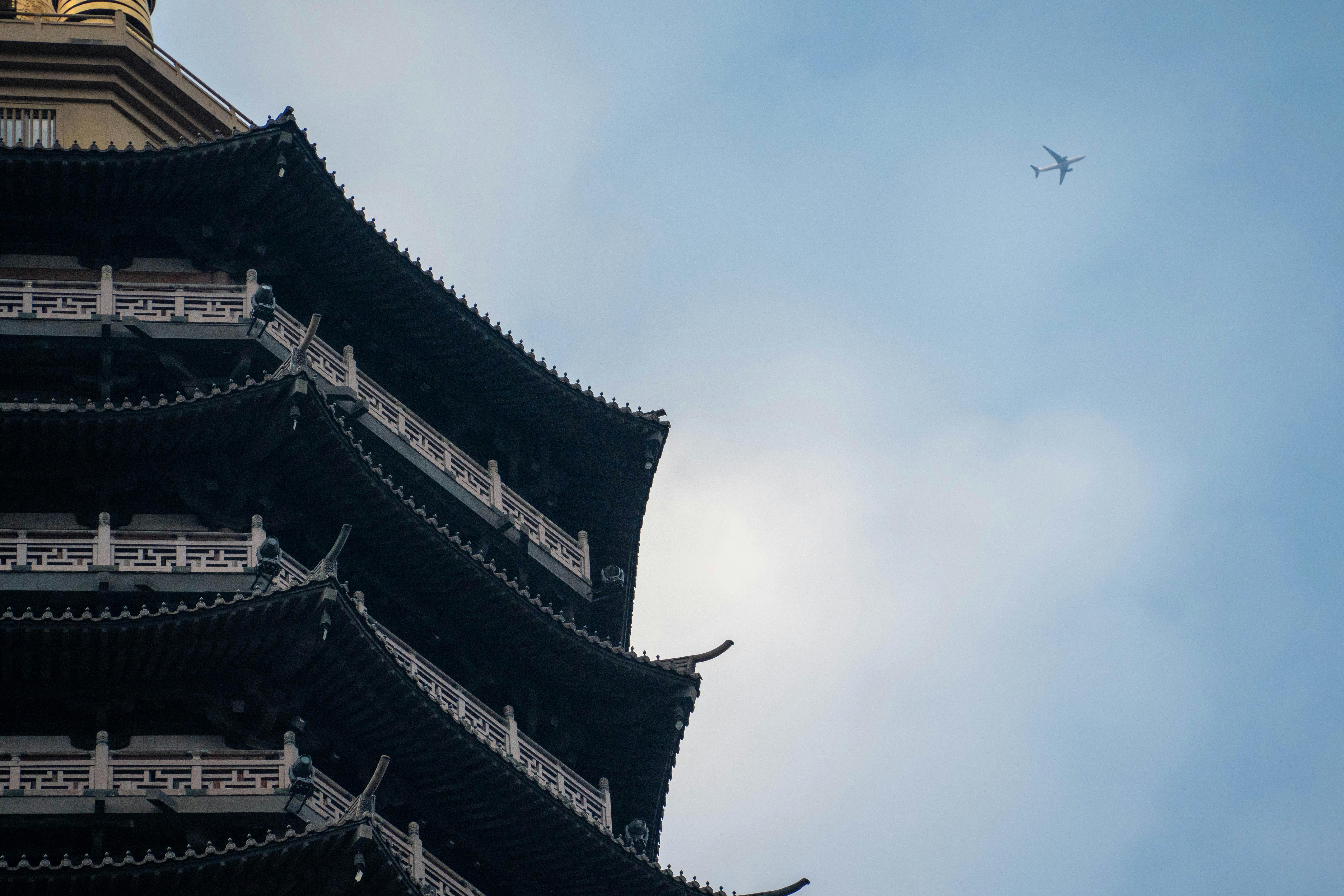 Traditional Chinese Pagoda with Airplane in Sky · Free Stock Photo