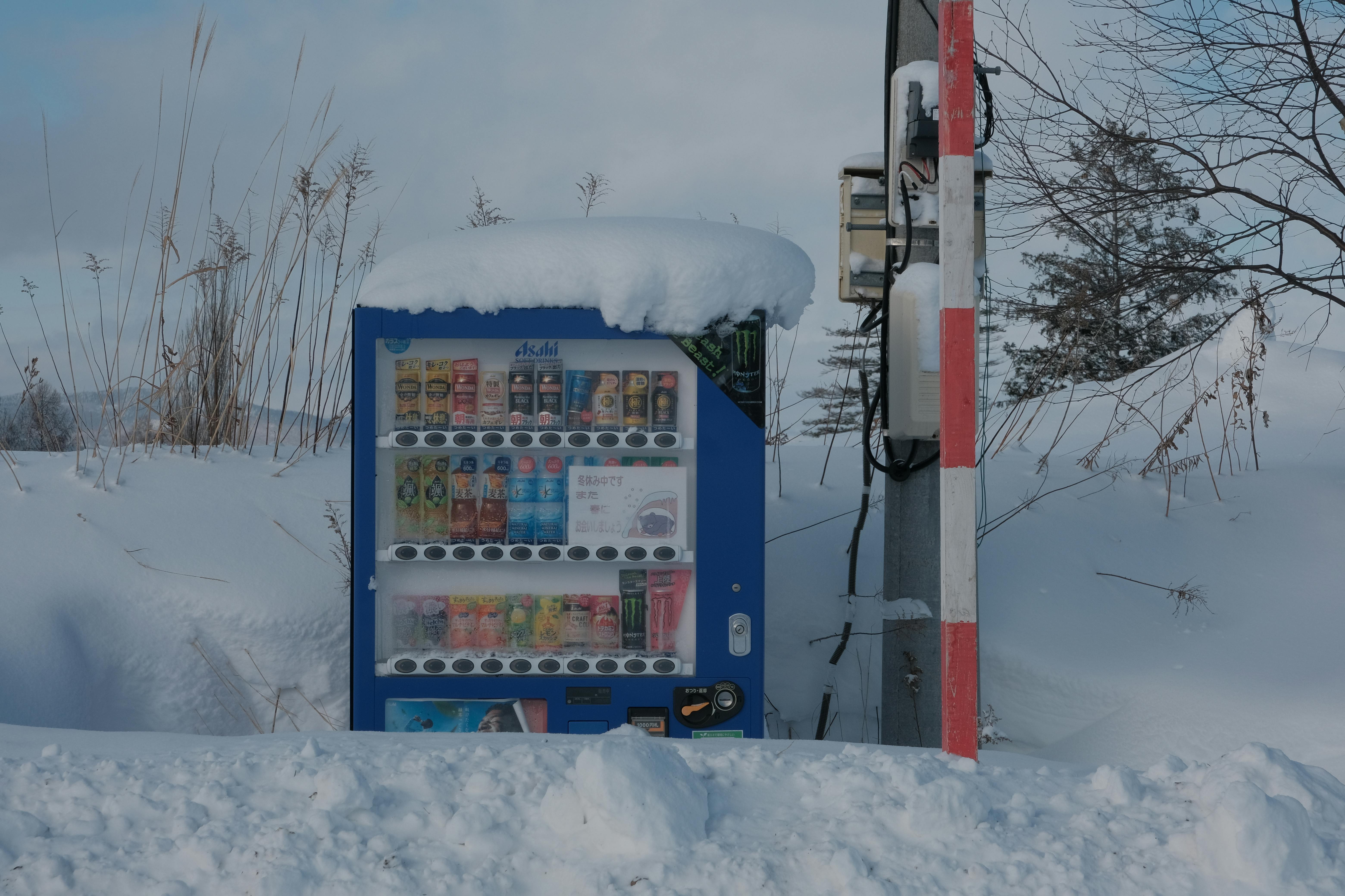Winter Vending Machine in Snowy Landscape · Free Stock Photo