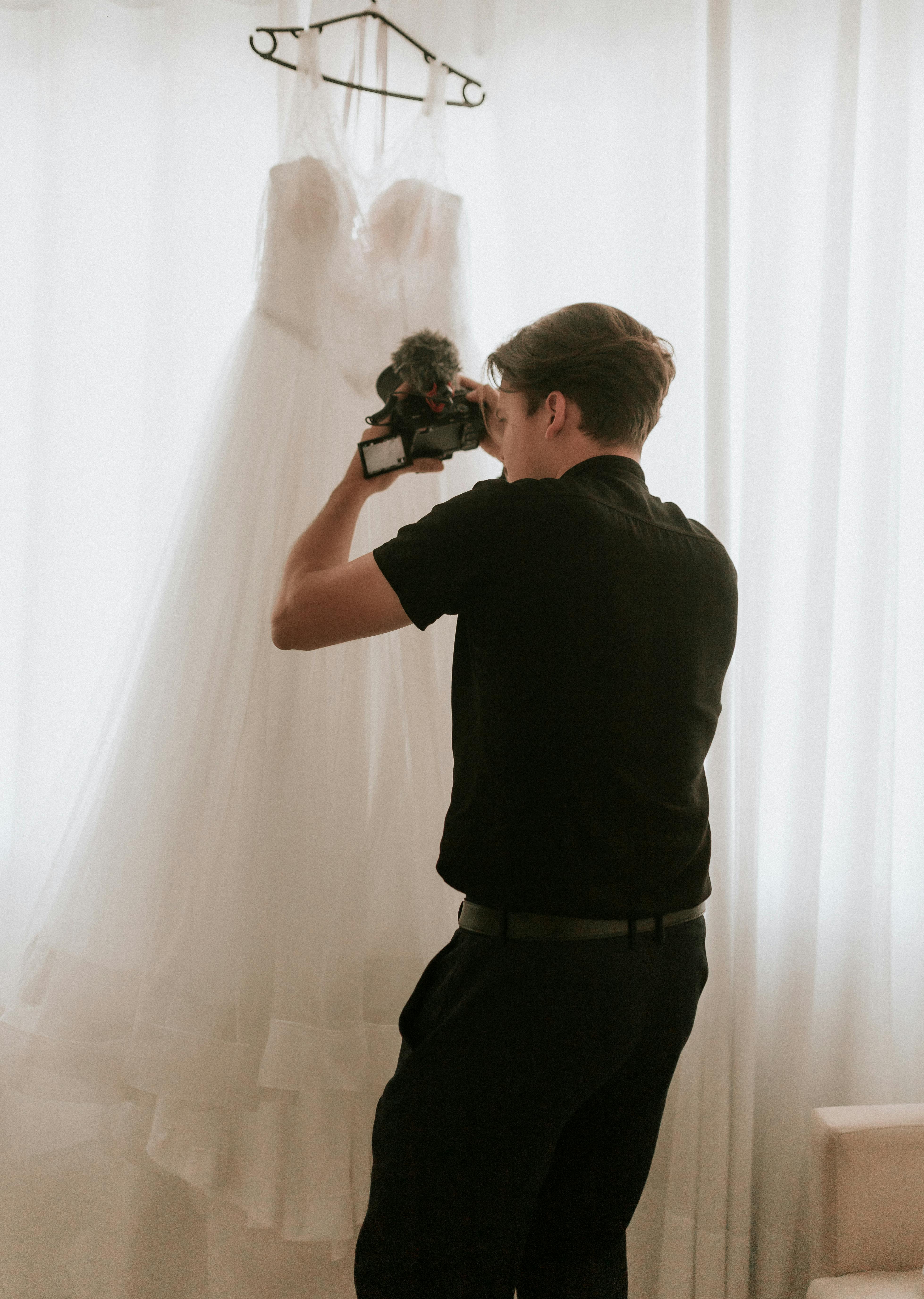 Photographer Captures Elegant Bridal Gown · Free Stock Photo