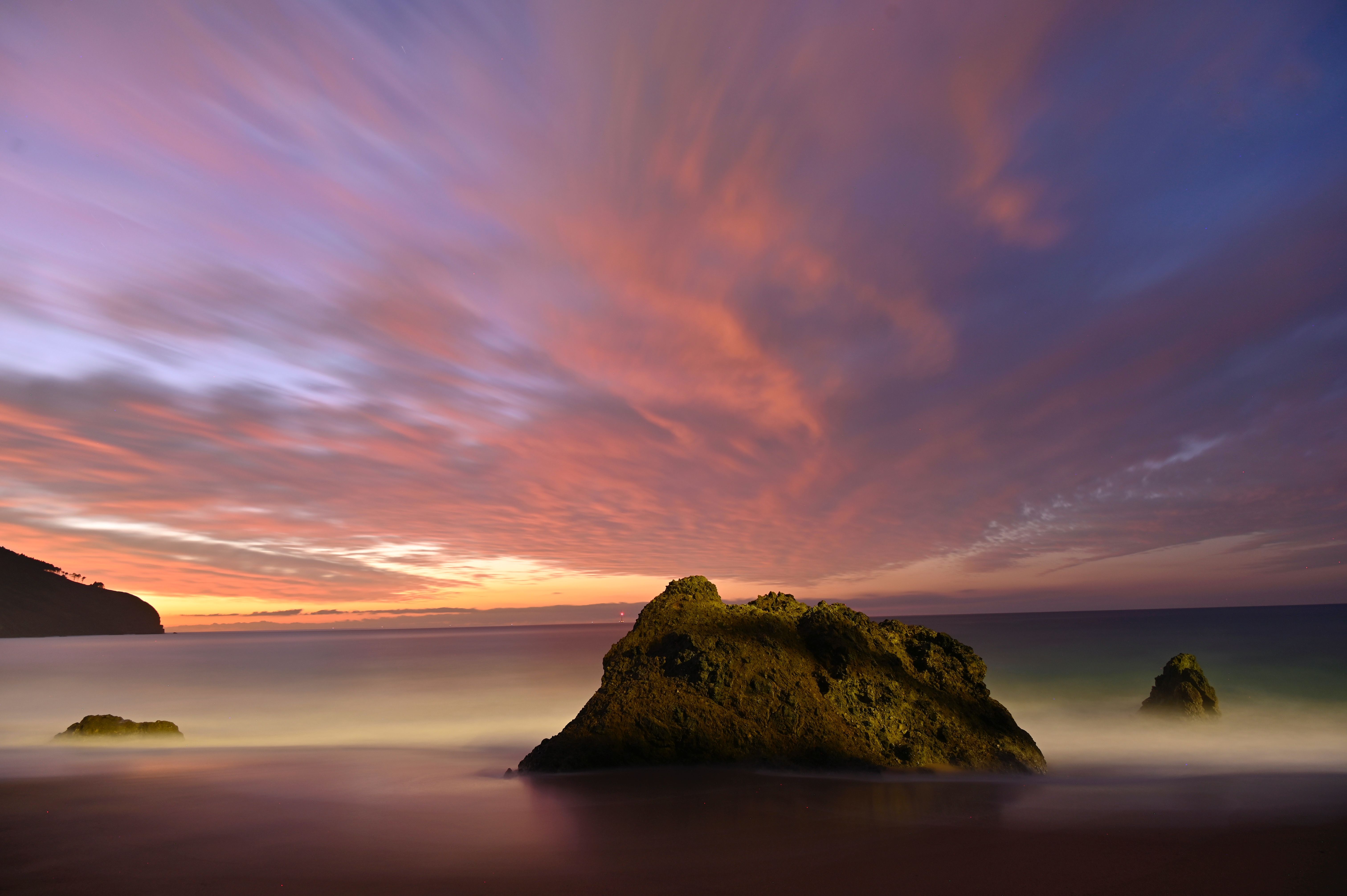 Stunning Sunset Over Rocky Coastline · Free Stock Photo