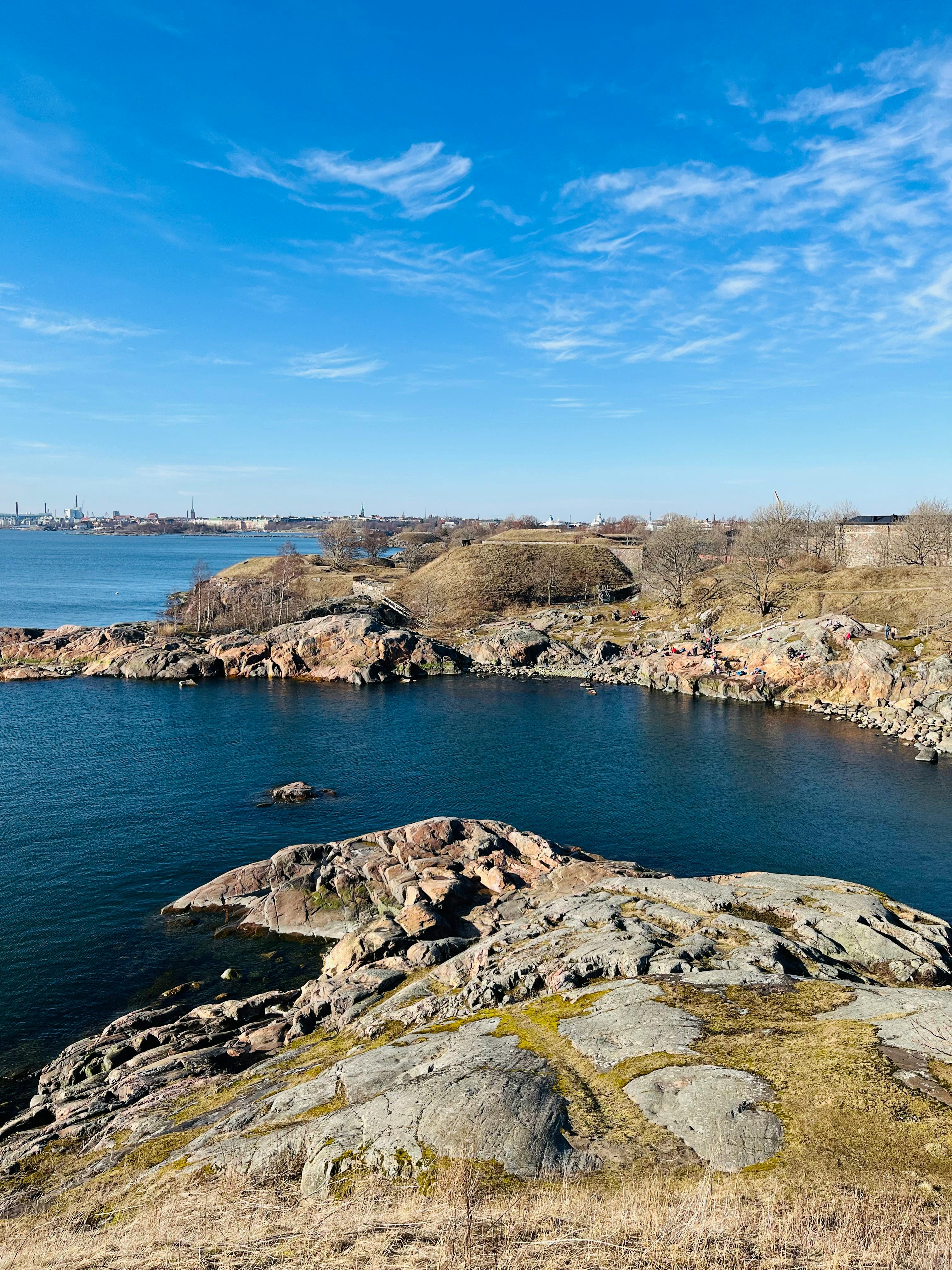 Scenic Rocky Landscape by Tranquil Blue Waters · Free Stock Photo