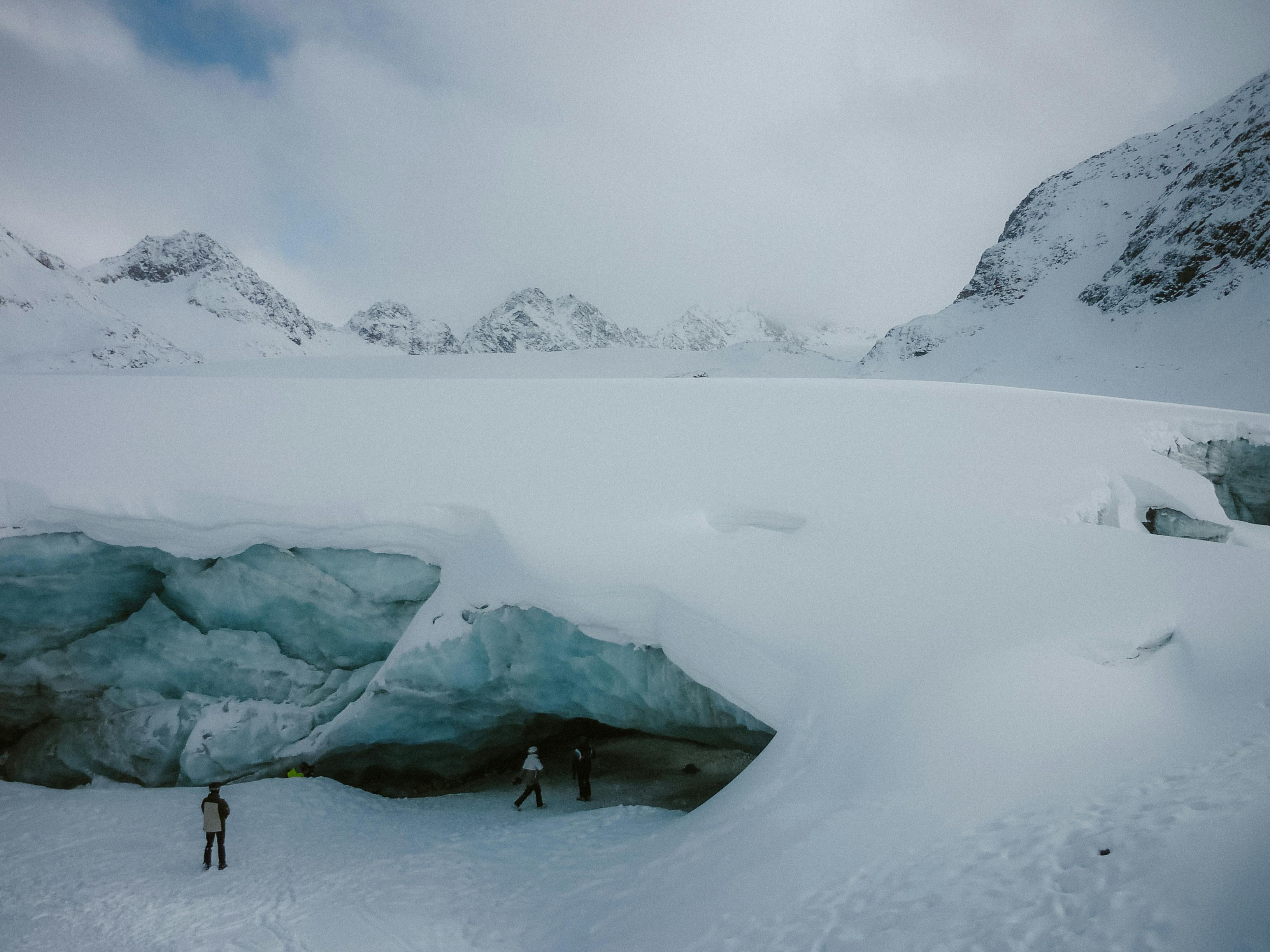 Snow-covered Glacial Landscape with Ice Cave · Free Stock Photo