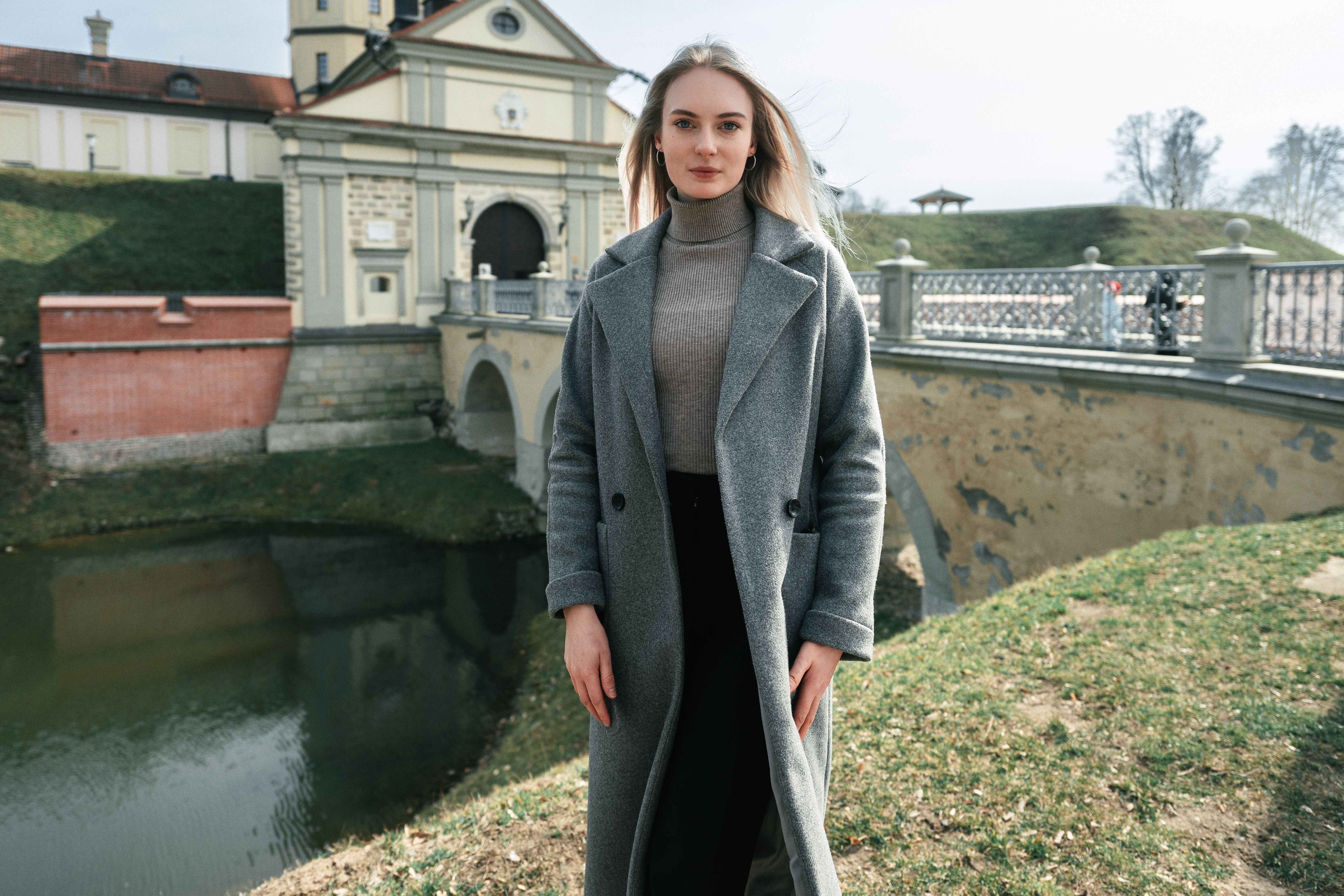 Stylish woman posing at historic Niasvizh Castle · Free Stock Photo