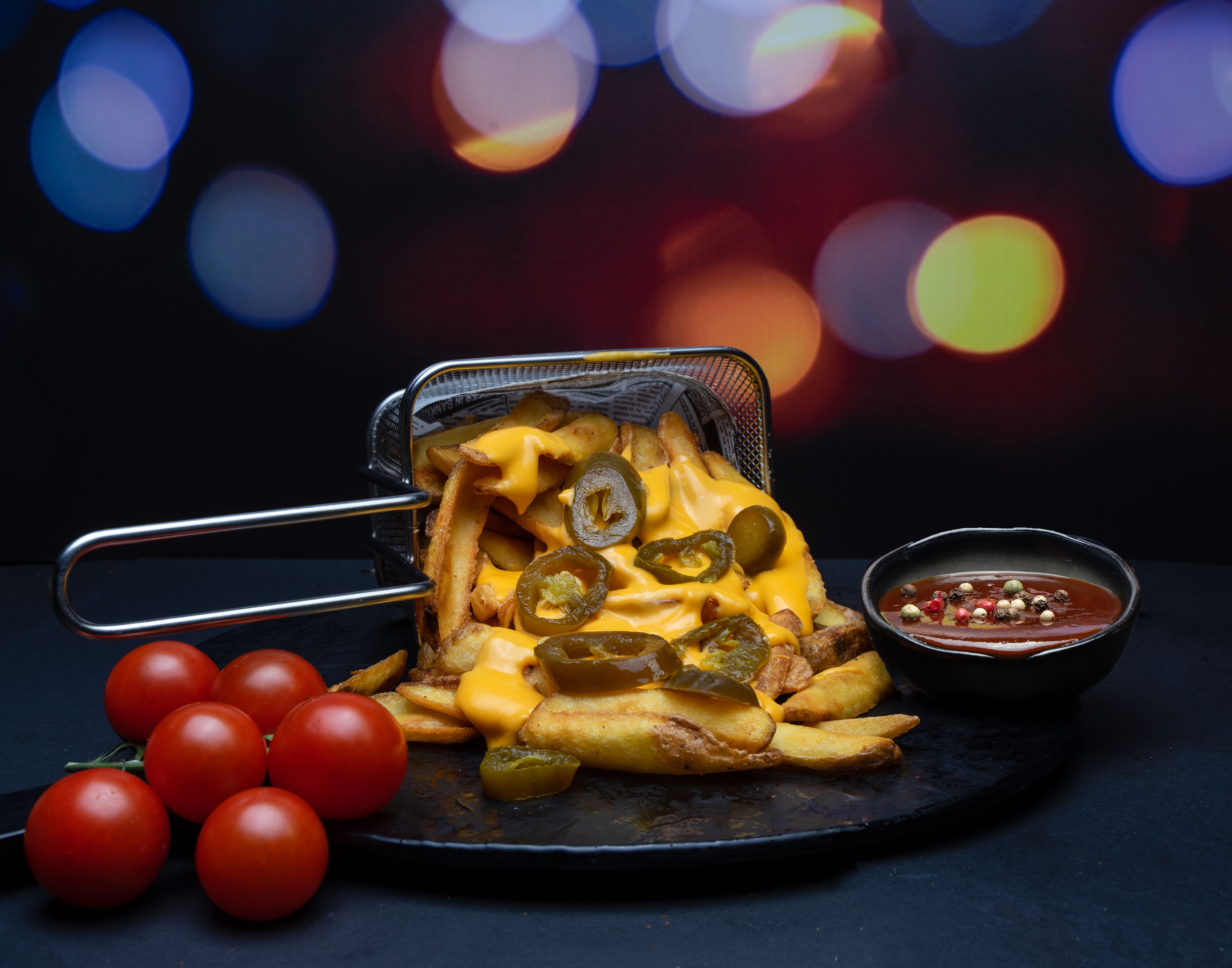 Cheesy Jalapeño Fries with Cherry Tomatoes and Dip · Free Stock Photo