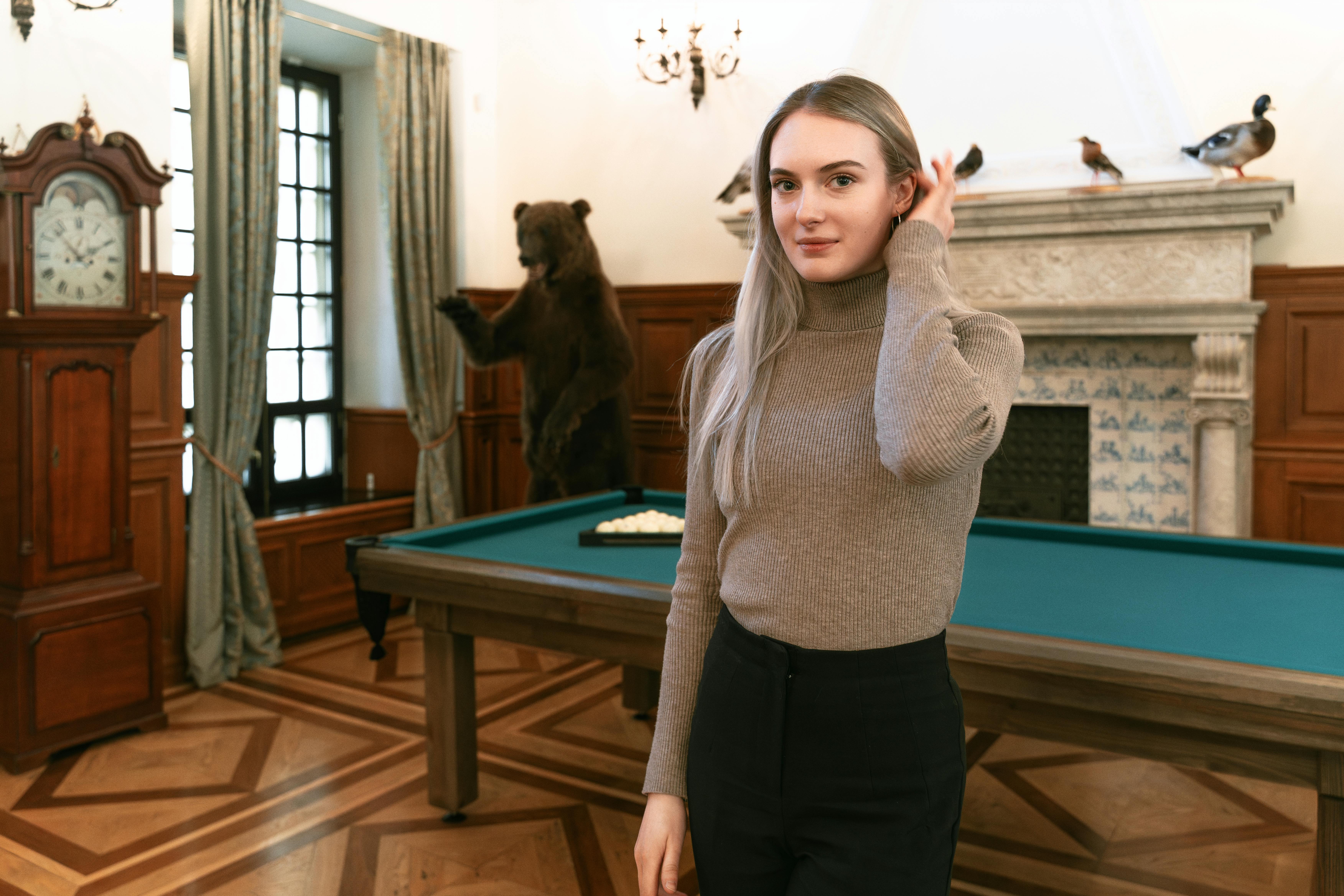 Elegant Portrait in Classic Billiard Room · Free Stock Photo