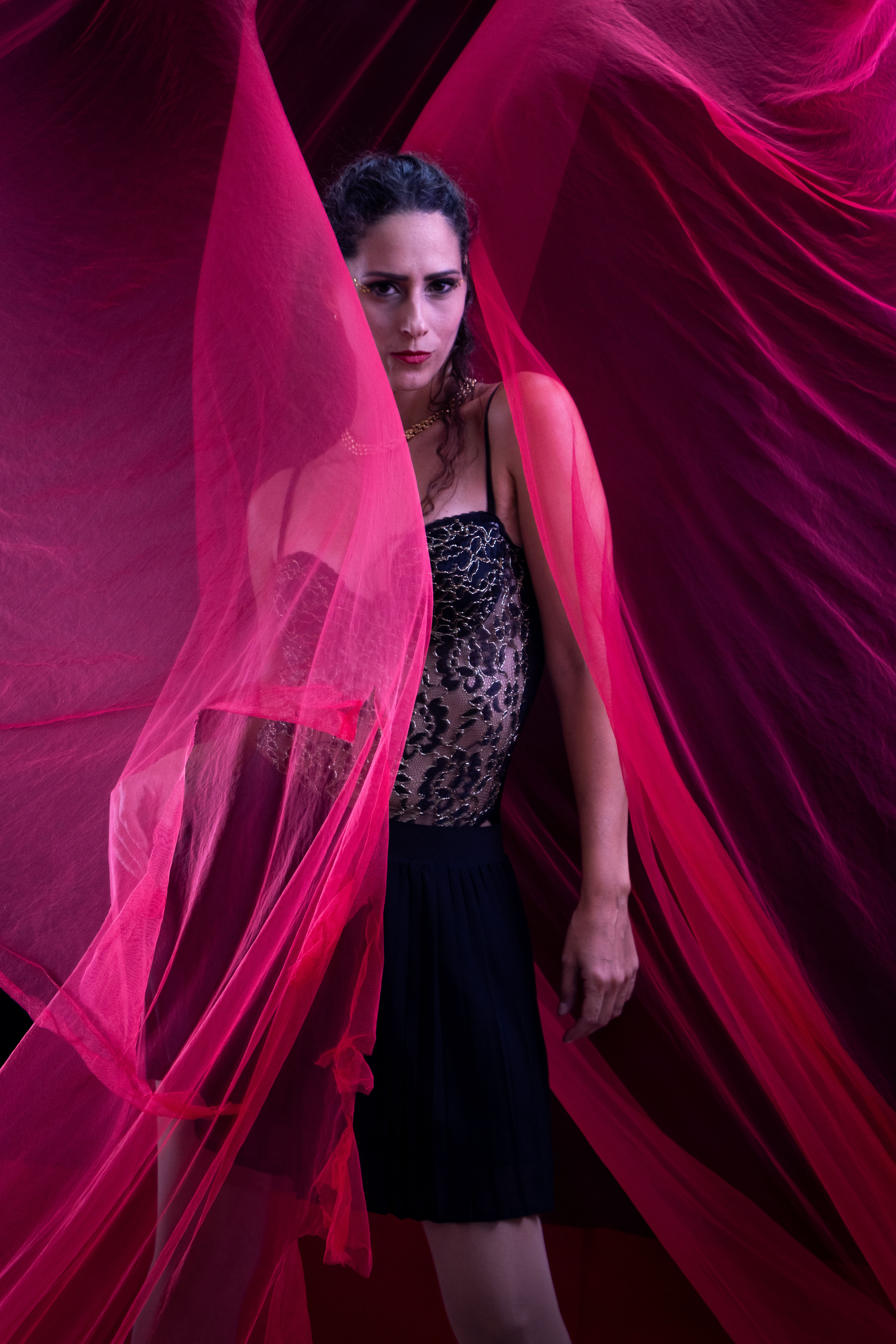 Elegant Woman Draped in Flowing Pink Fabric · Free Stock Photo