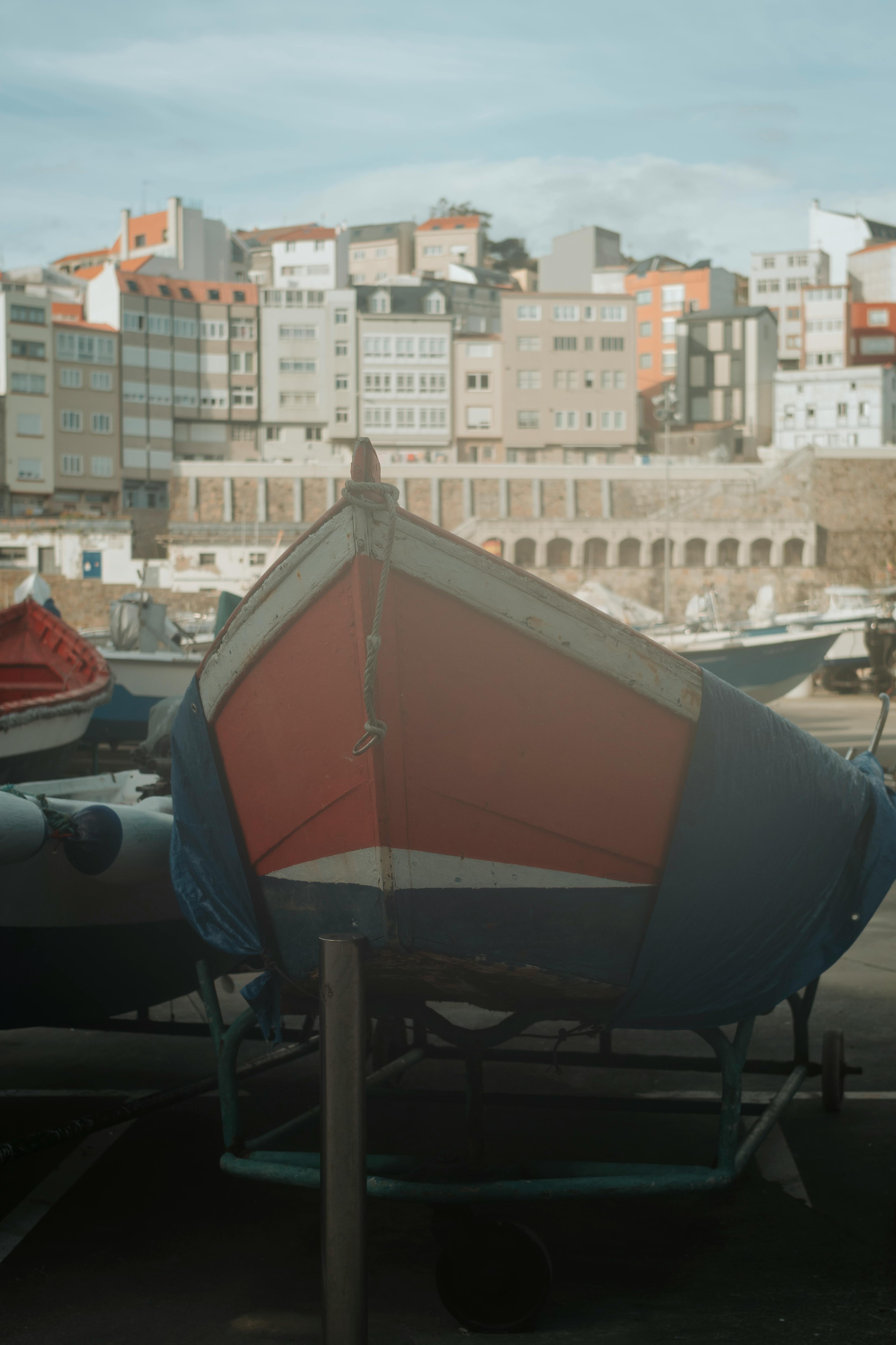 Rustic Boat in Charming Coastal Town · Free Stock Photo
