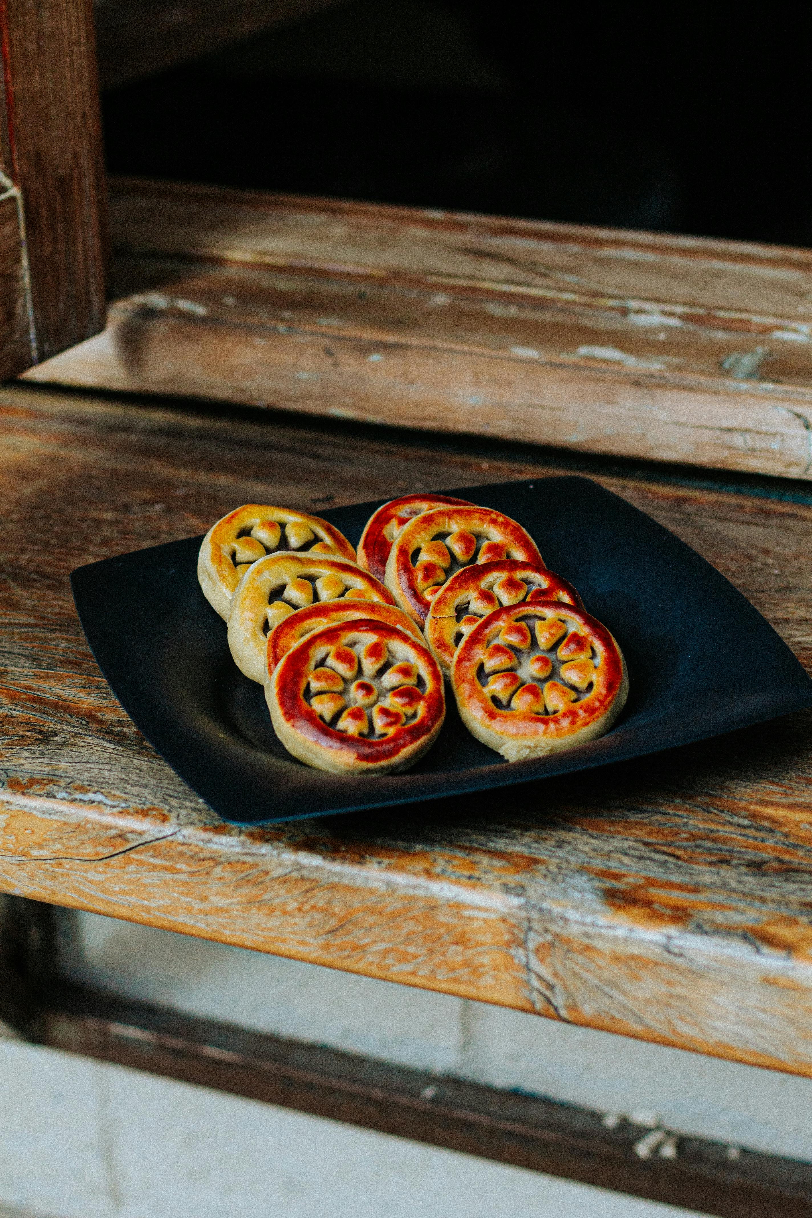 Colorful Pastry Pizzas on Black Plate · Free Stock Photo