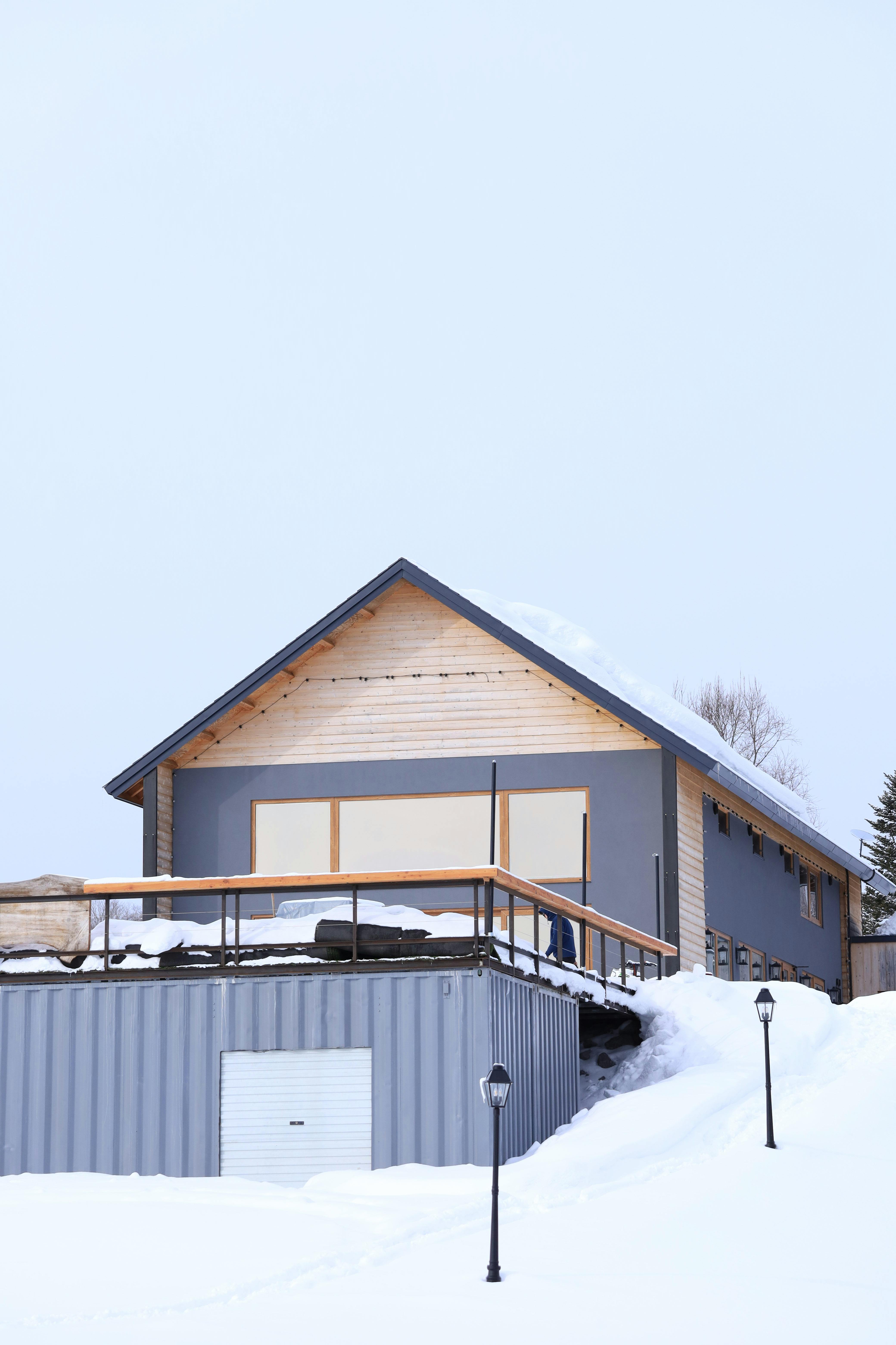 Modern Snow-Covered House in Winter Landscape · Free Stock Photo
