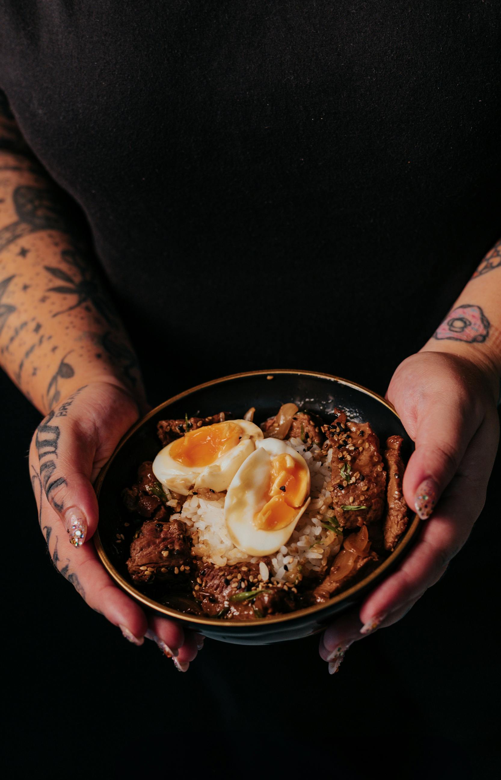 Tattooed Hands Holding Gourmet Rice Bowl · Free Stock Photo