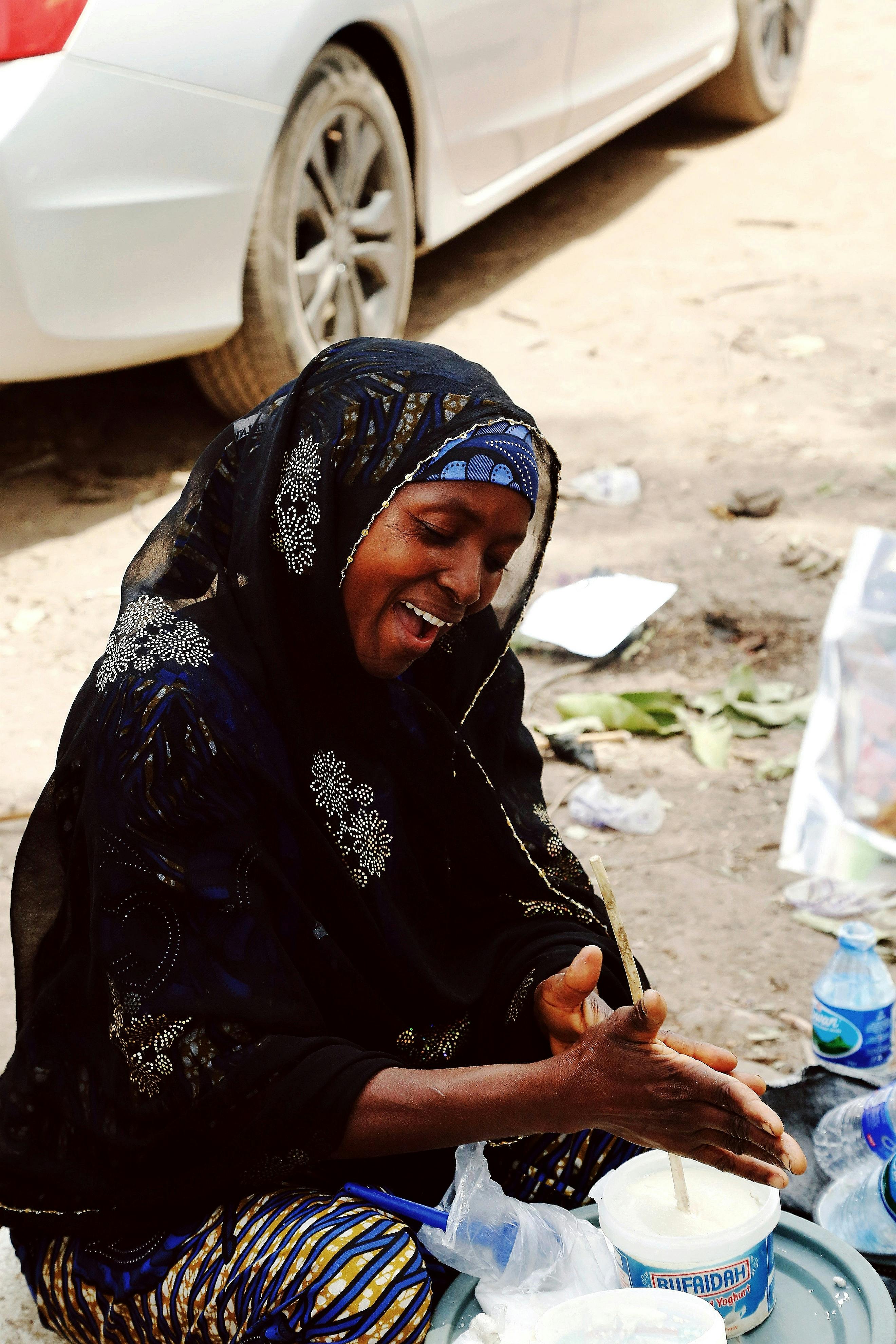 African Woman Preparing Traditional Food Outdoors · Free Stock Photo