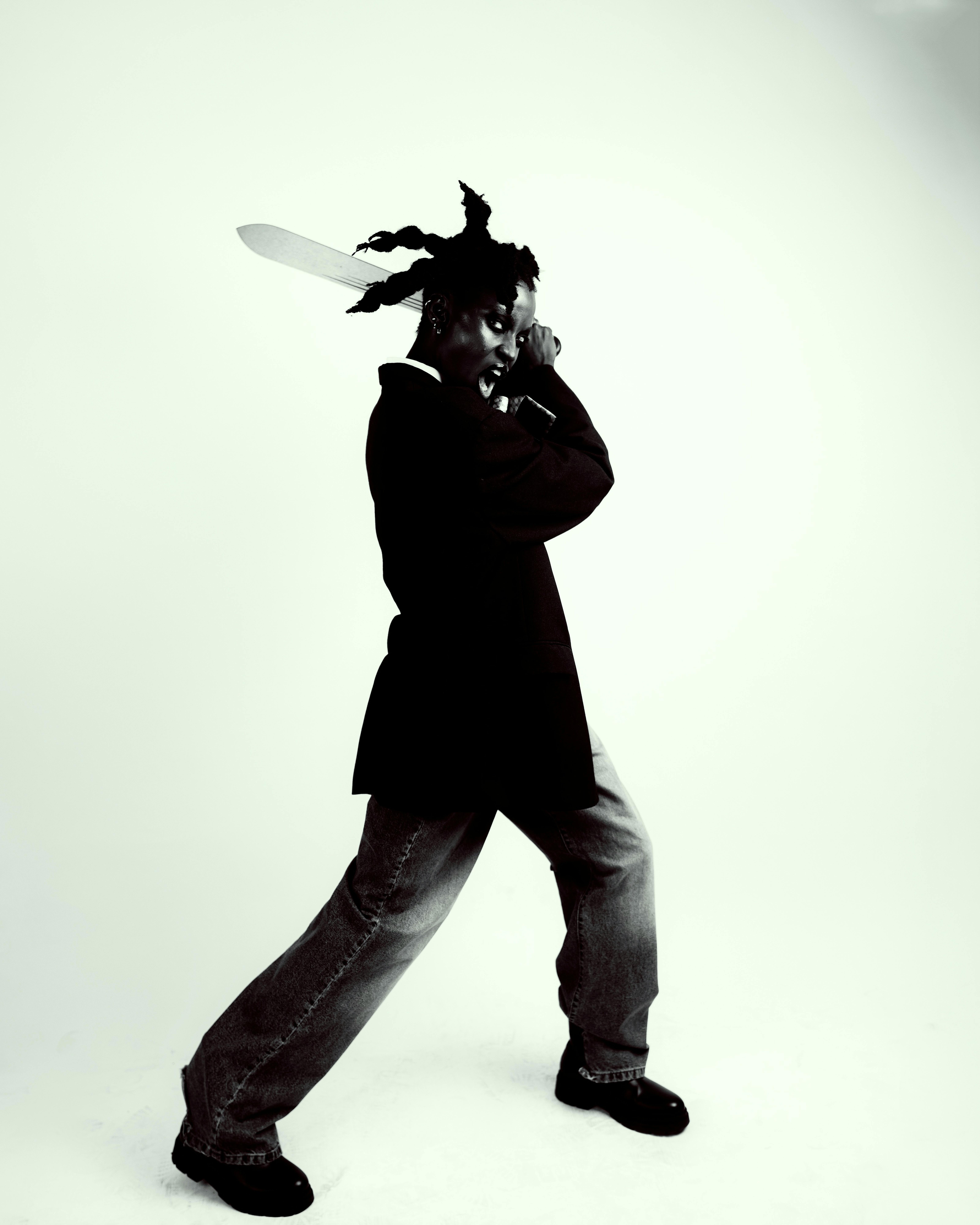 Artistic Portrait of a Playful Person with Dagger · Free Stock Photo