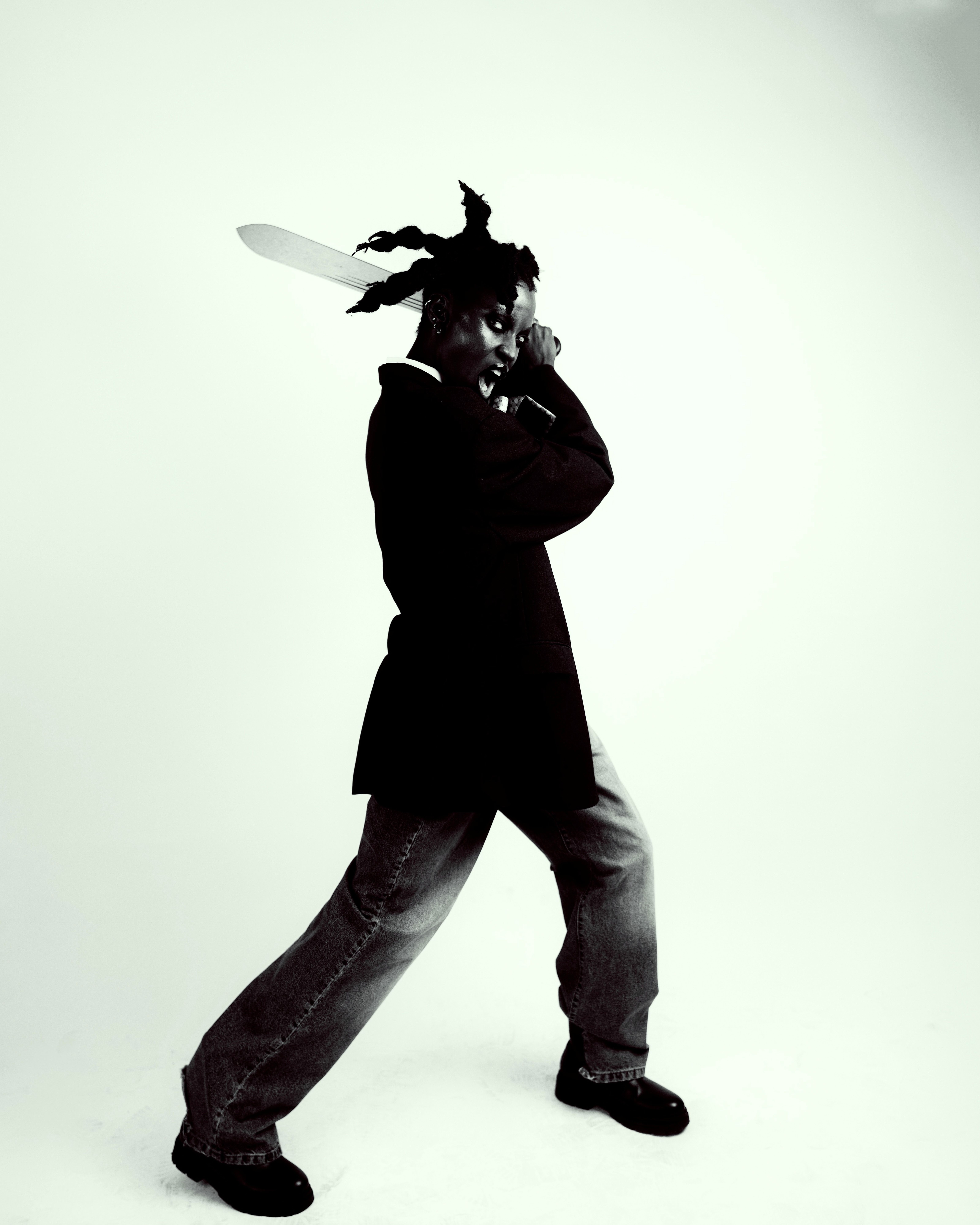 Artistic Portrait of a Playful Person with Dagger · Free Stock Photo