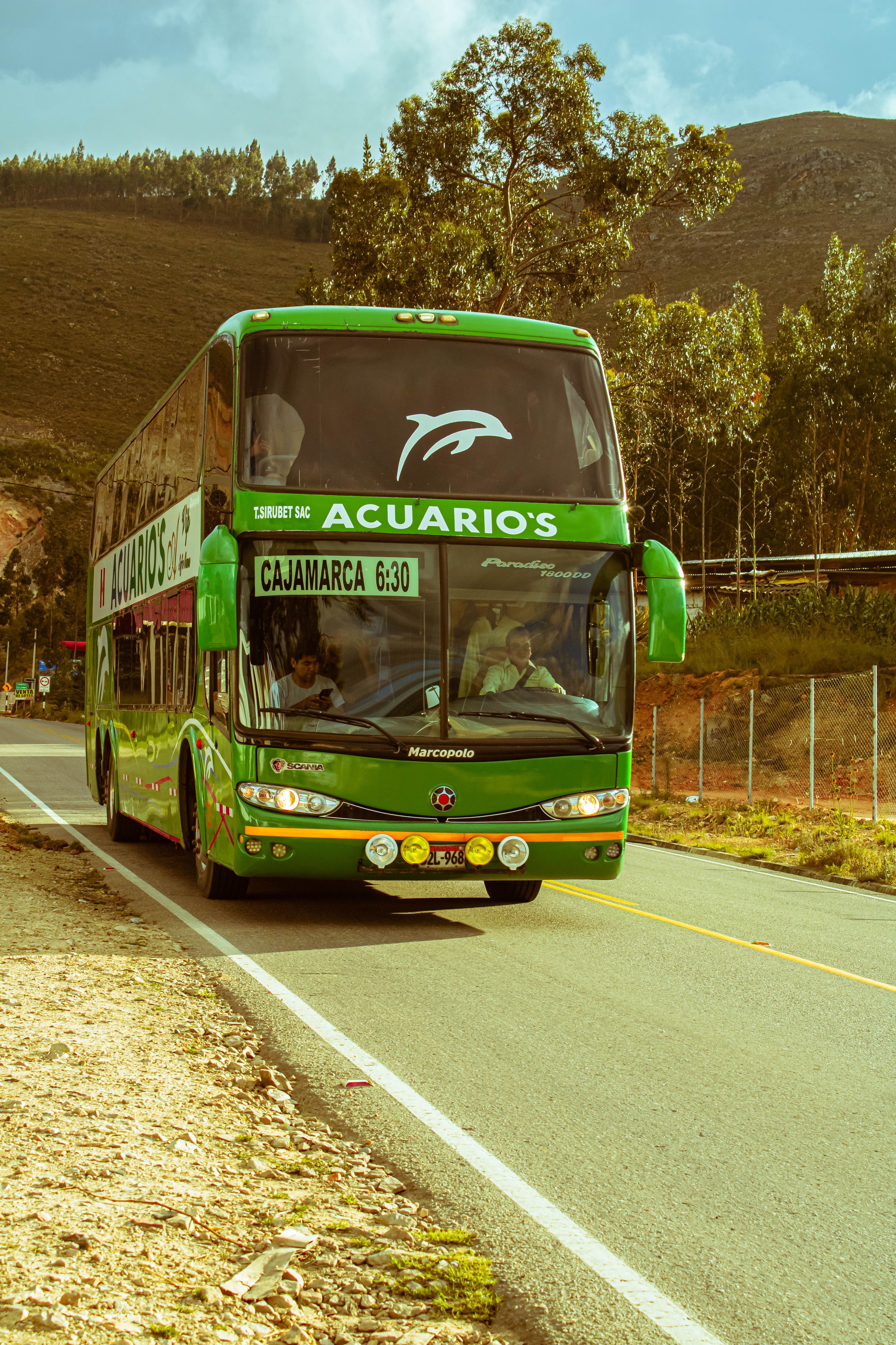 Double Decker Bus on Scenic Mountain Road · Free Stock Photo