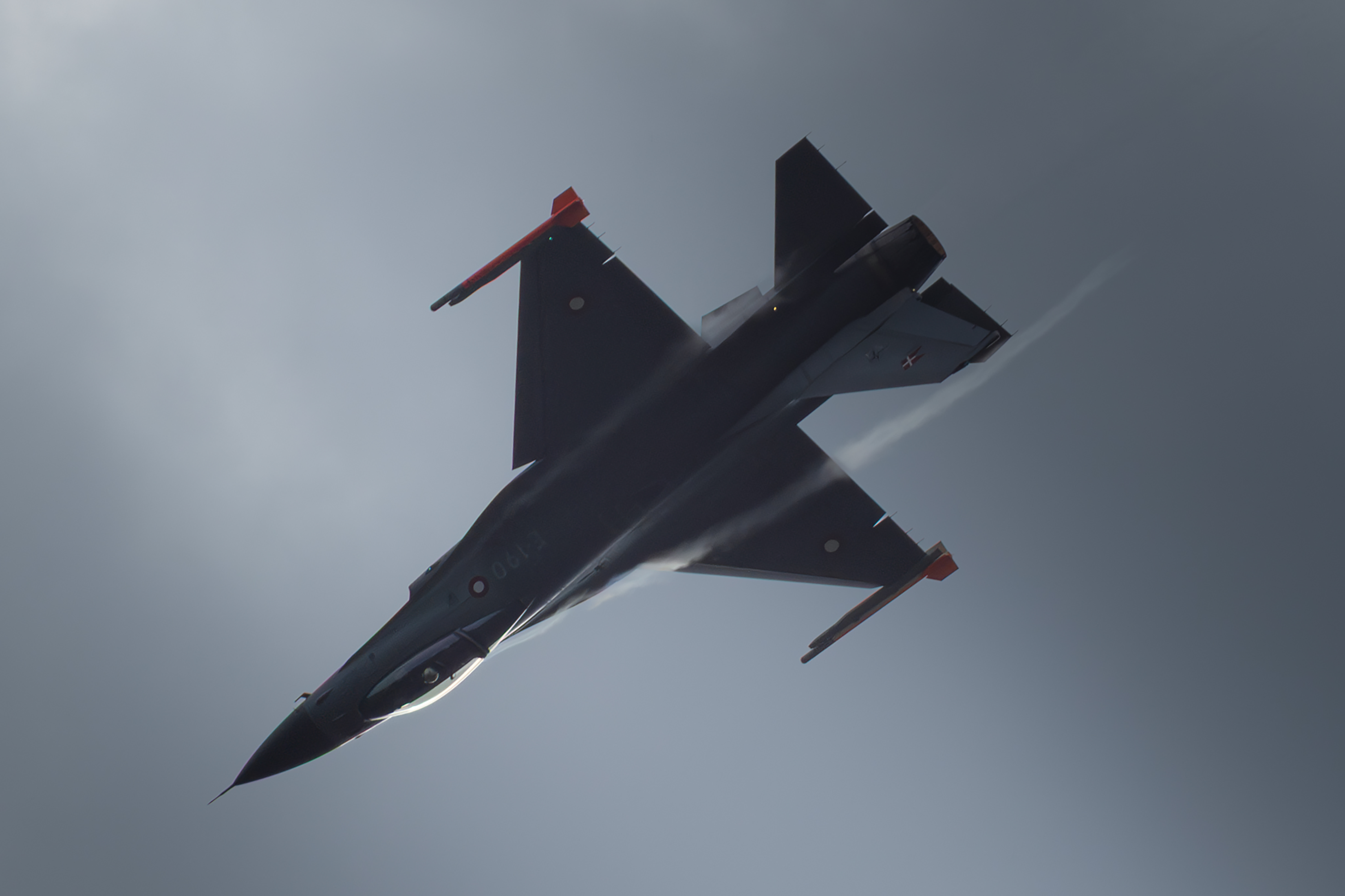 Dynamic Fighter Jet Maneuver in Overcast Sky · Free Stock Photo