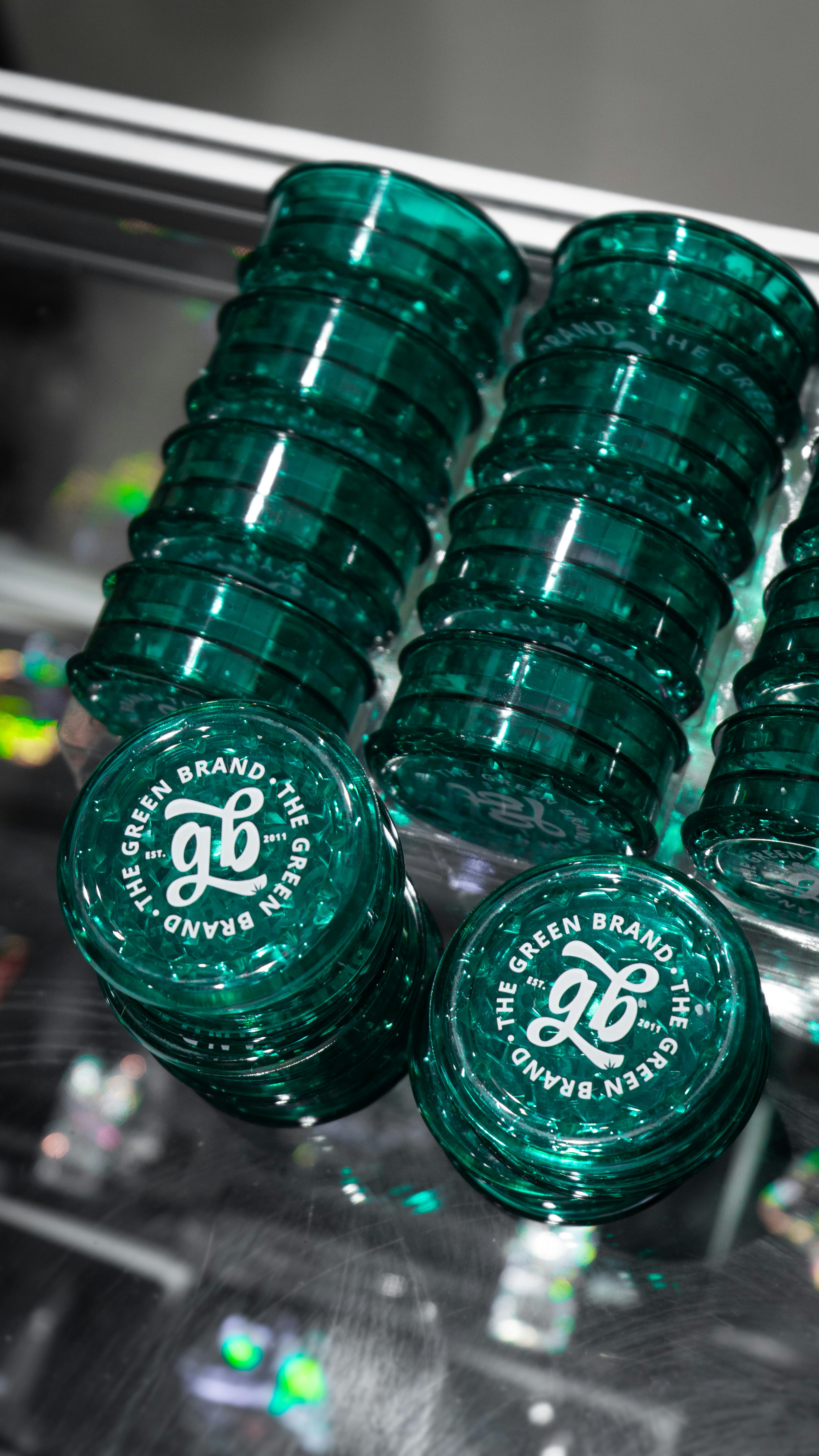 Green Circular Containers Displayed in Exhibition · Free Stock Photo