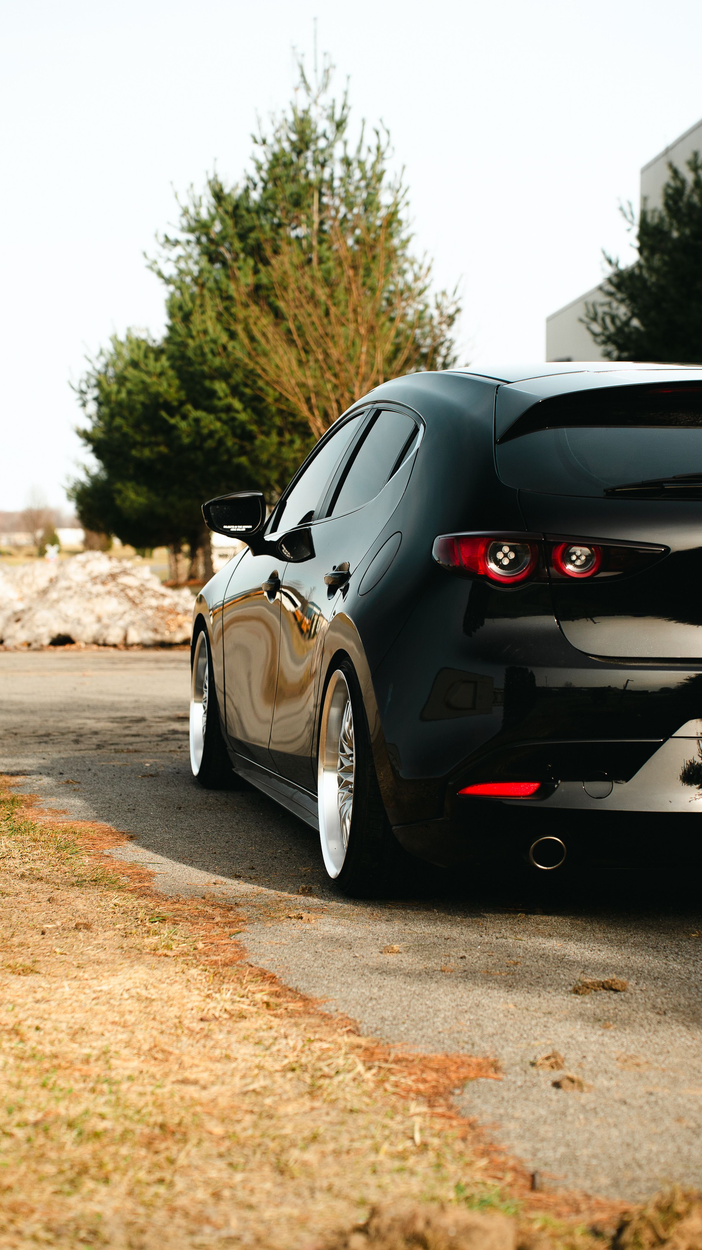 Sleek Black Hatchback Car in Outdoor Setting · Free Stock Photo