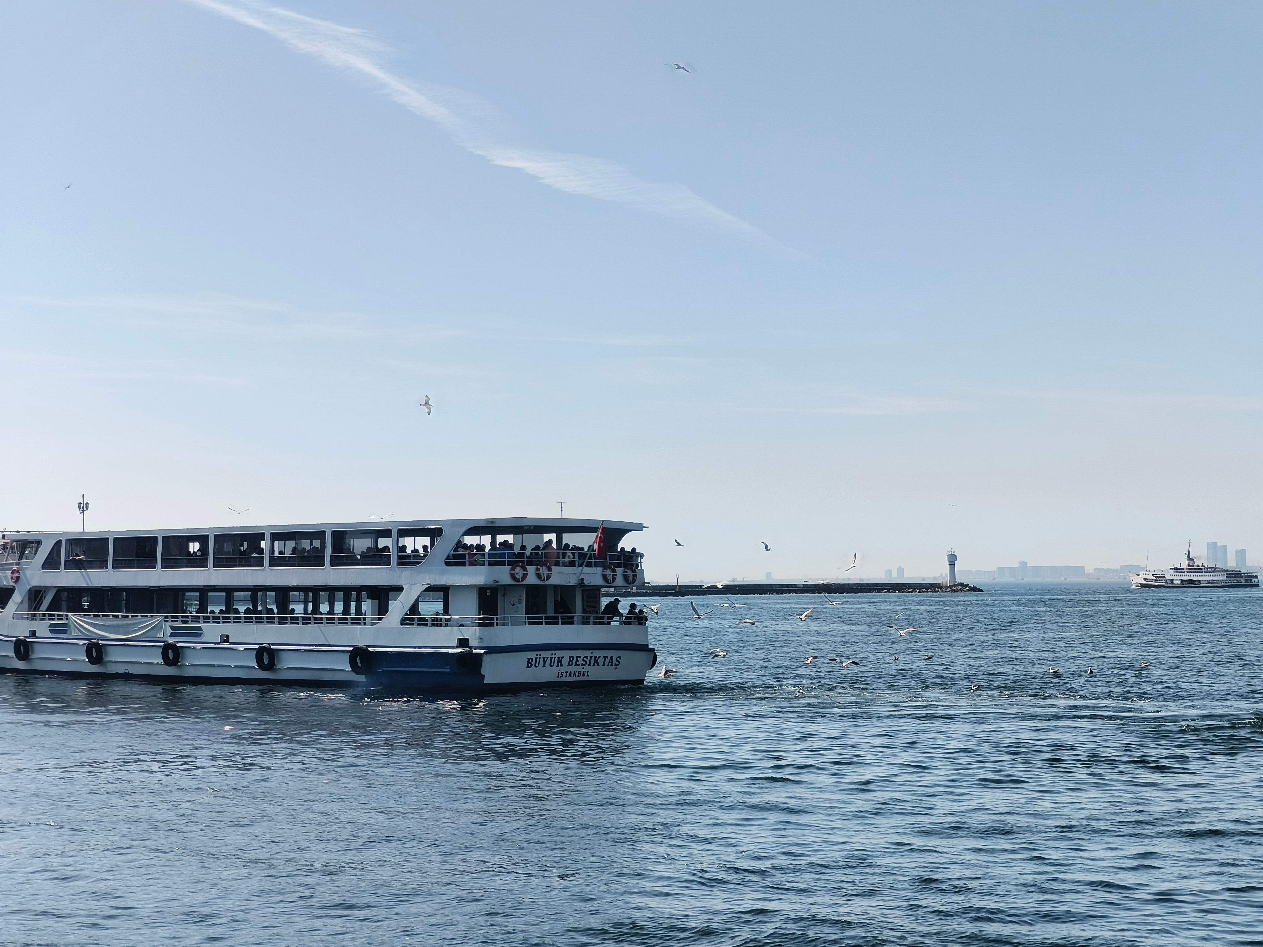 Ferry Sailing on a Serene Sunny Day · Free Stock Photo