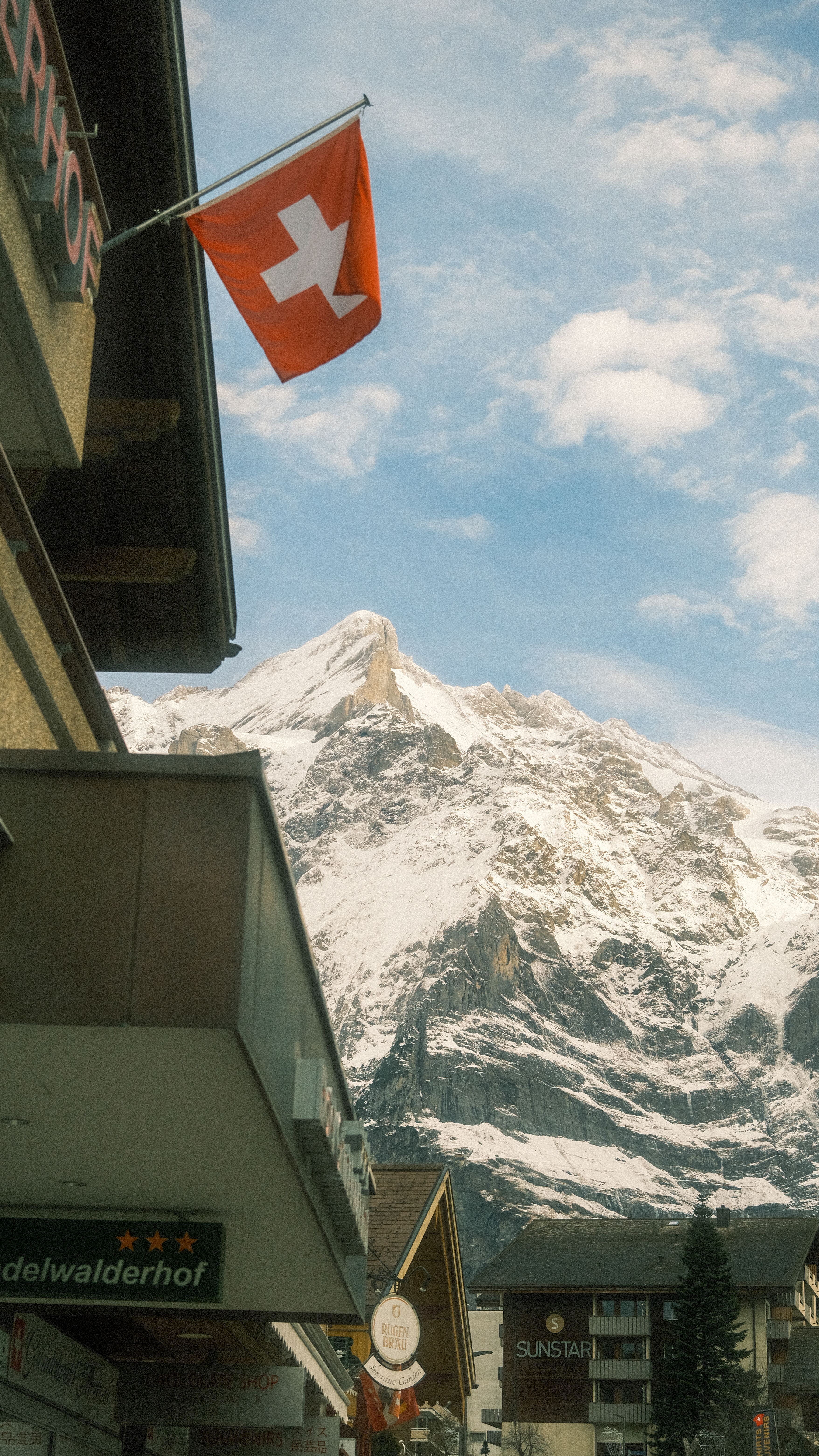 Scenic View of Swiss Alps with Flag in Grindelwald · Free Stock Photo