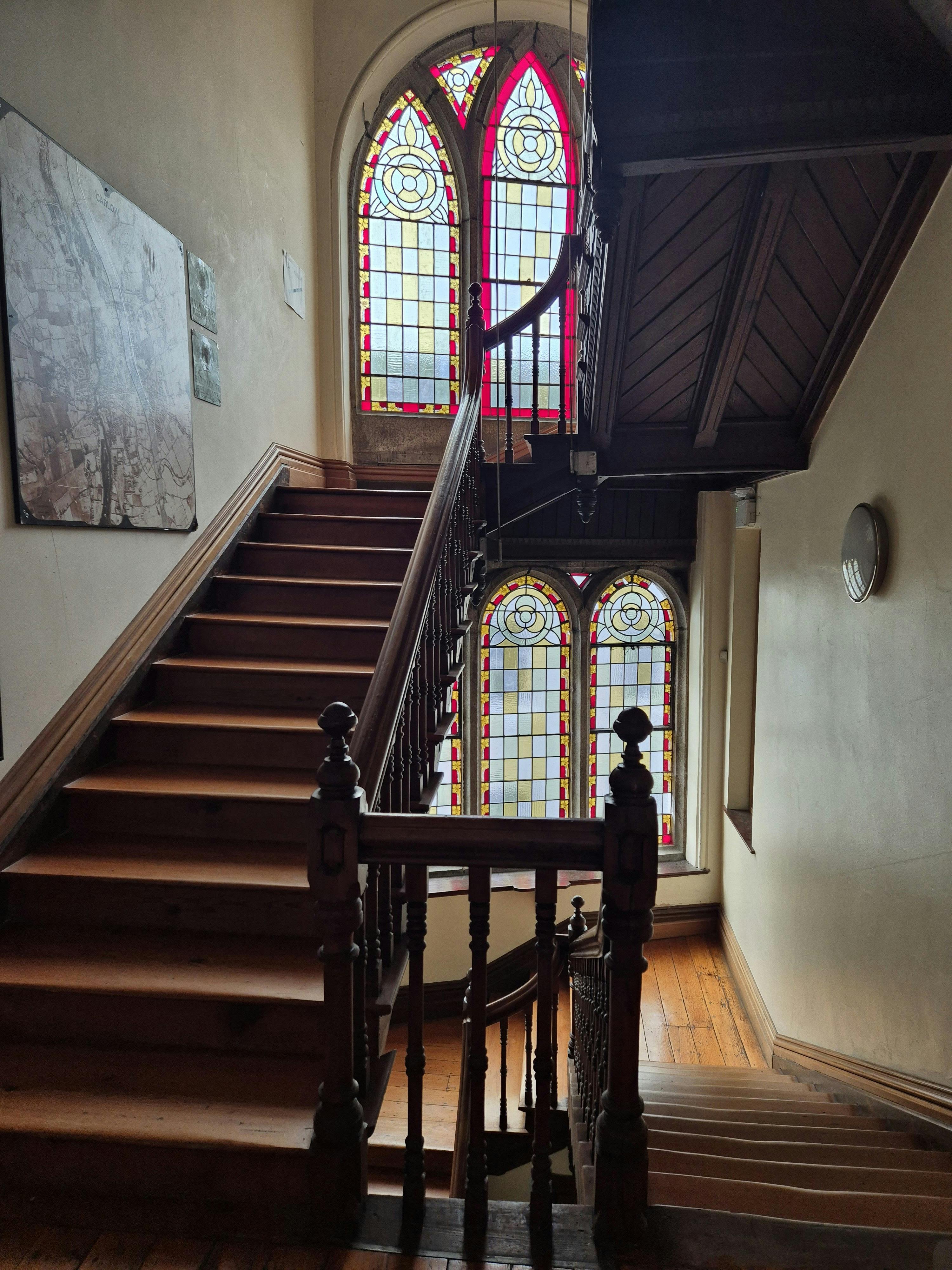 Historic Staircase with Stained Glass Windows · Free Stock Photo