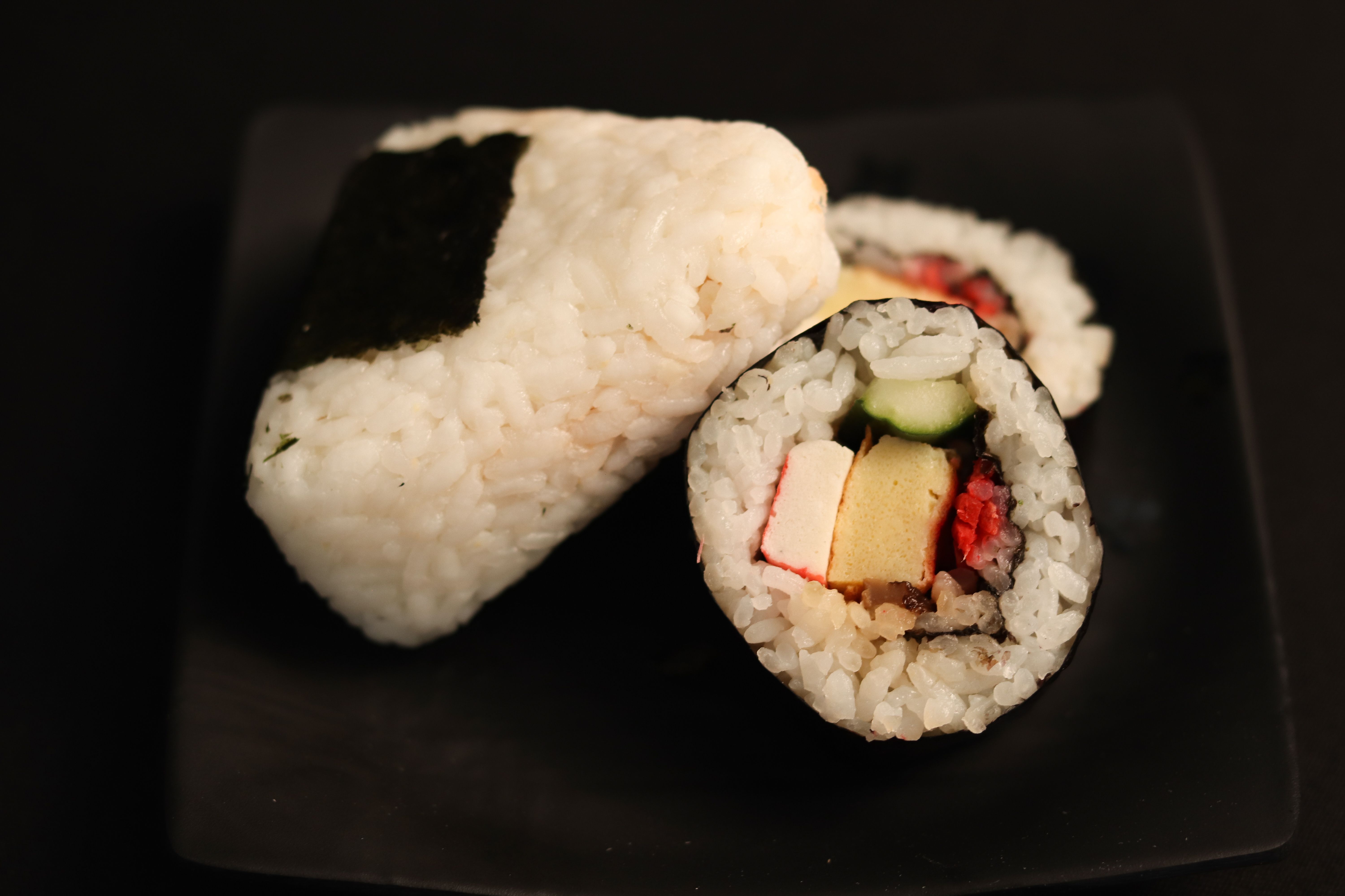 Delicious Sushi and Onigiri on a Plate · Free Stock Photo