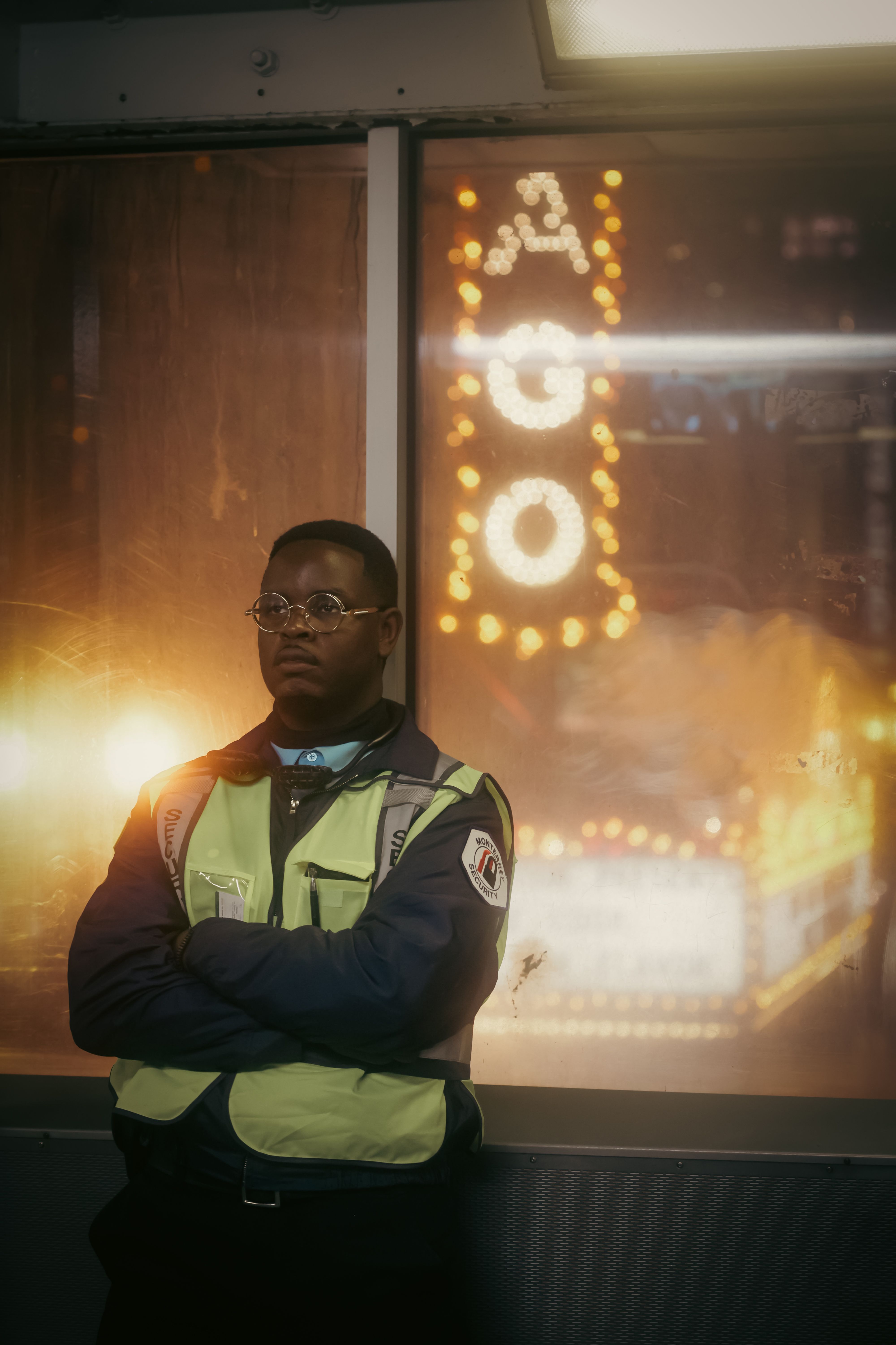 Night Portrait of Security Guard by Neon Sign · Free Stock Photo