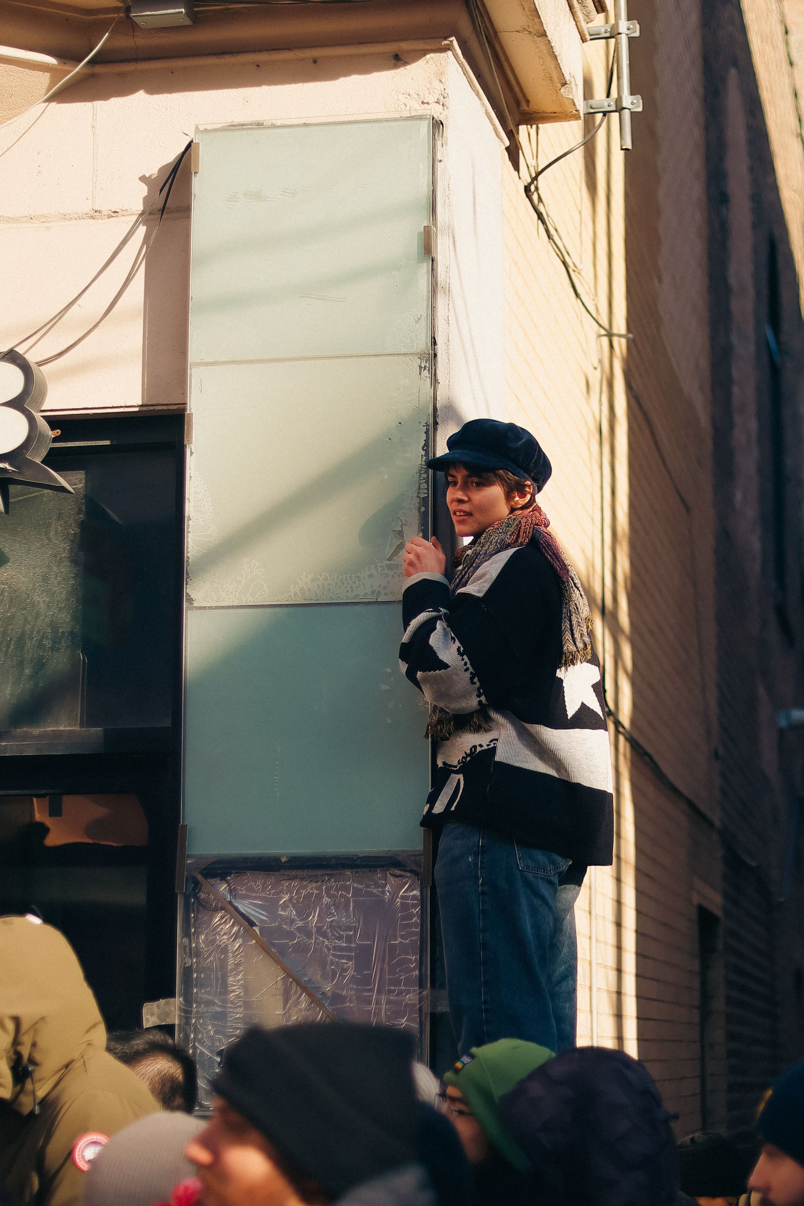 Man Observing Street View in Urban Setting · Free Stock Photo