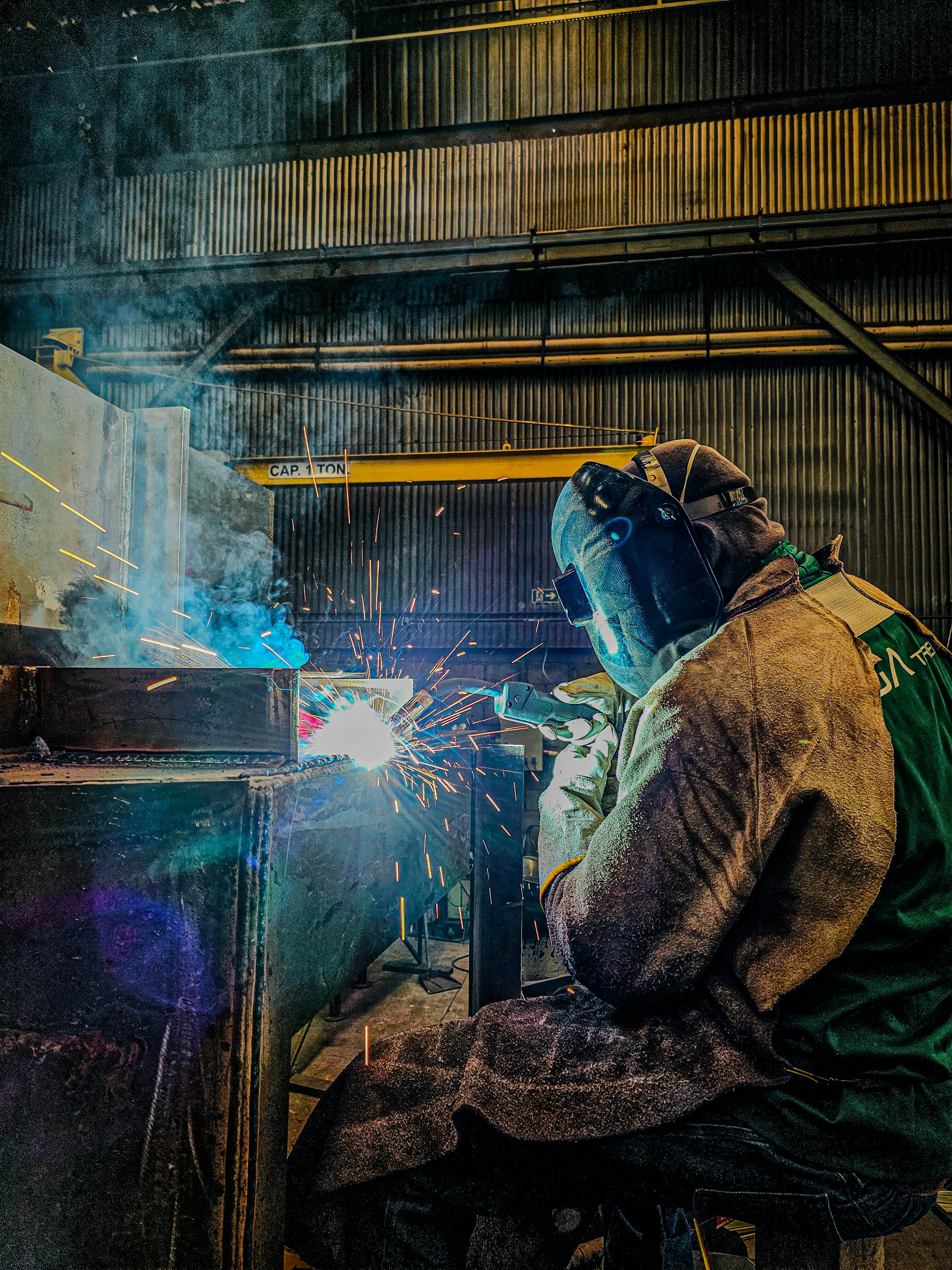 Industrial Welder at Work in Brazilian Factory · Free Stock Photo